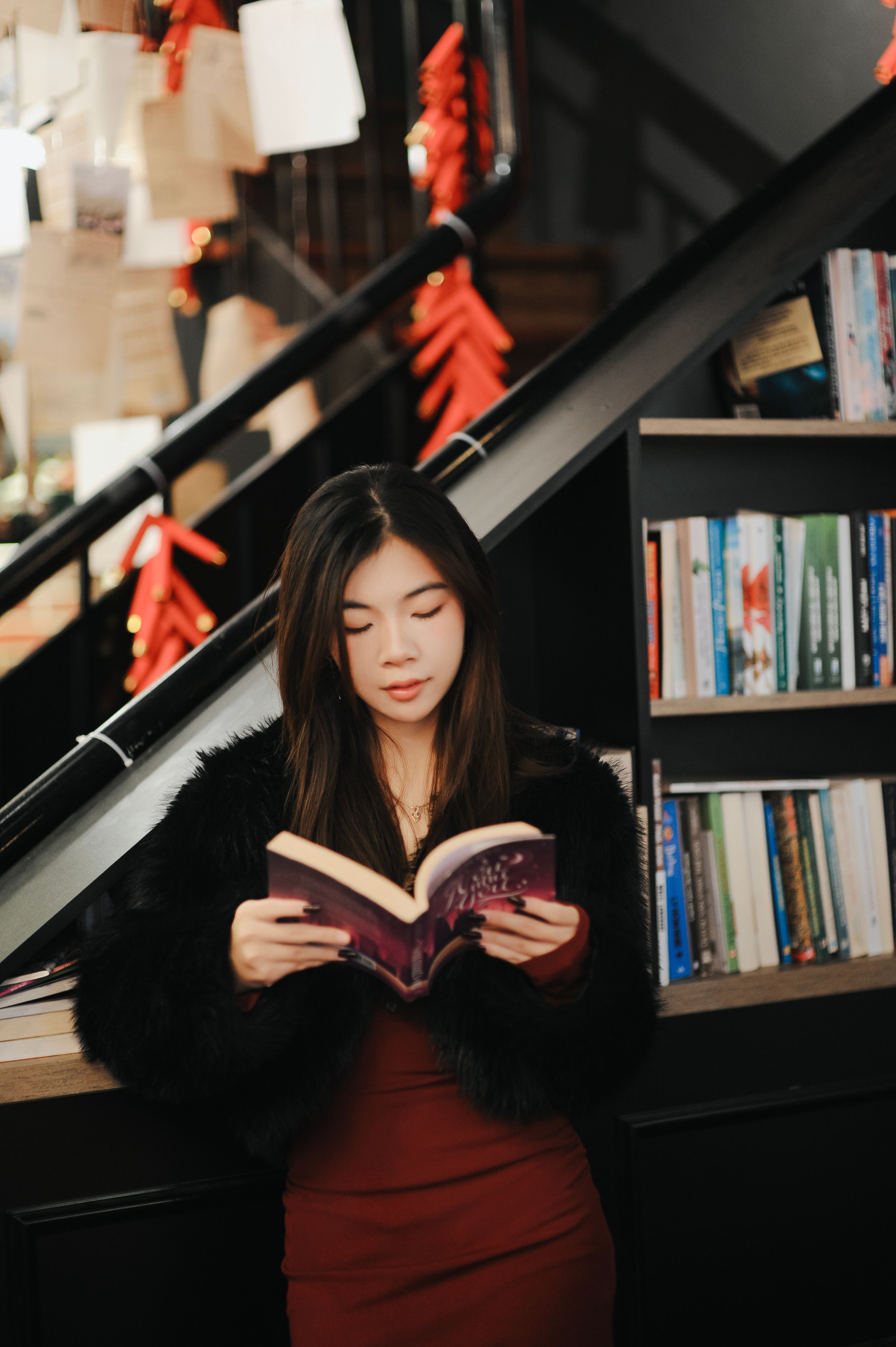 Lady Reading a Book in a Library · Free Stock Photo