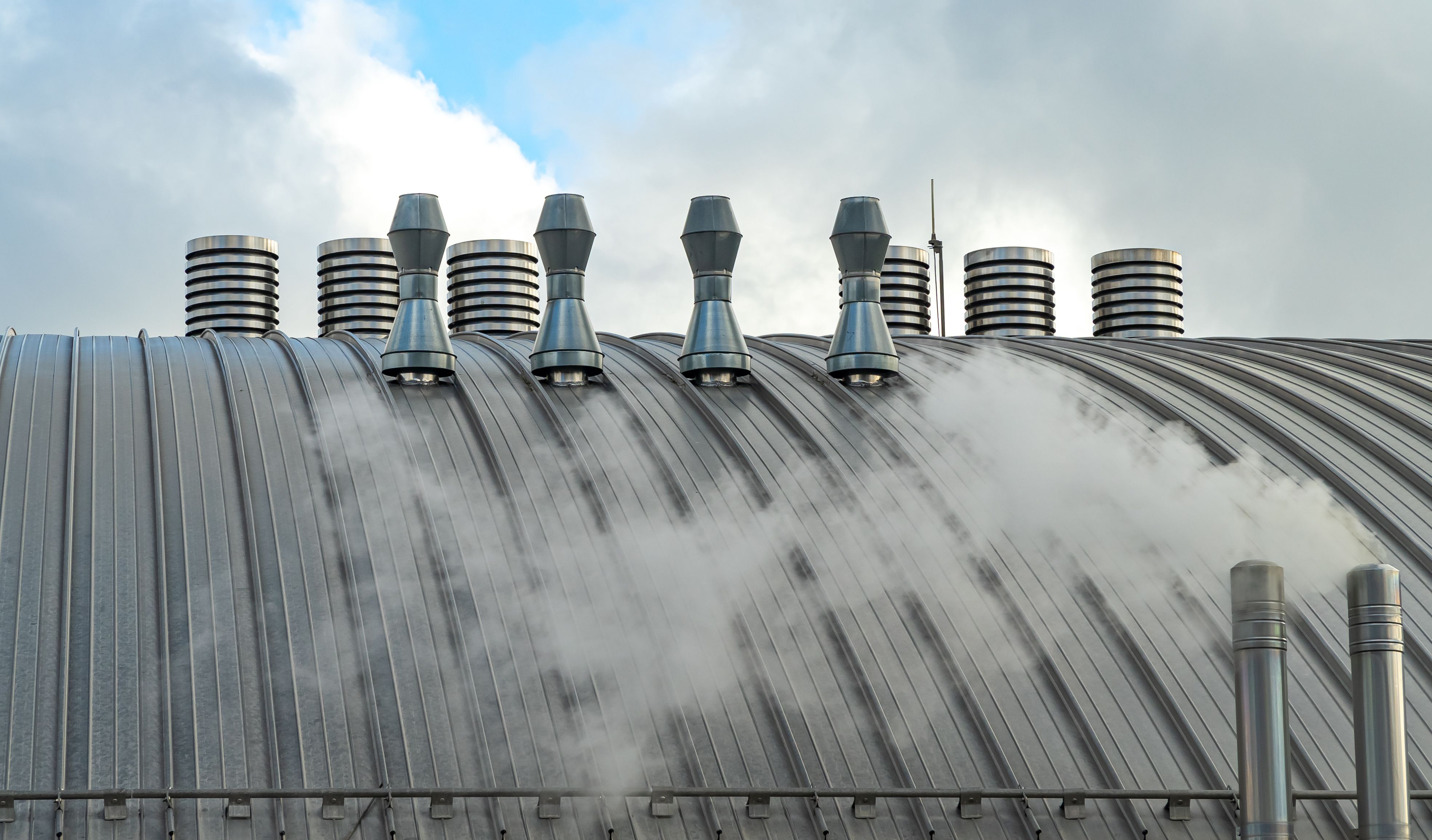 Industrial Rooftop Vents Emitting Steam · Free Stock Photo