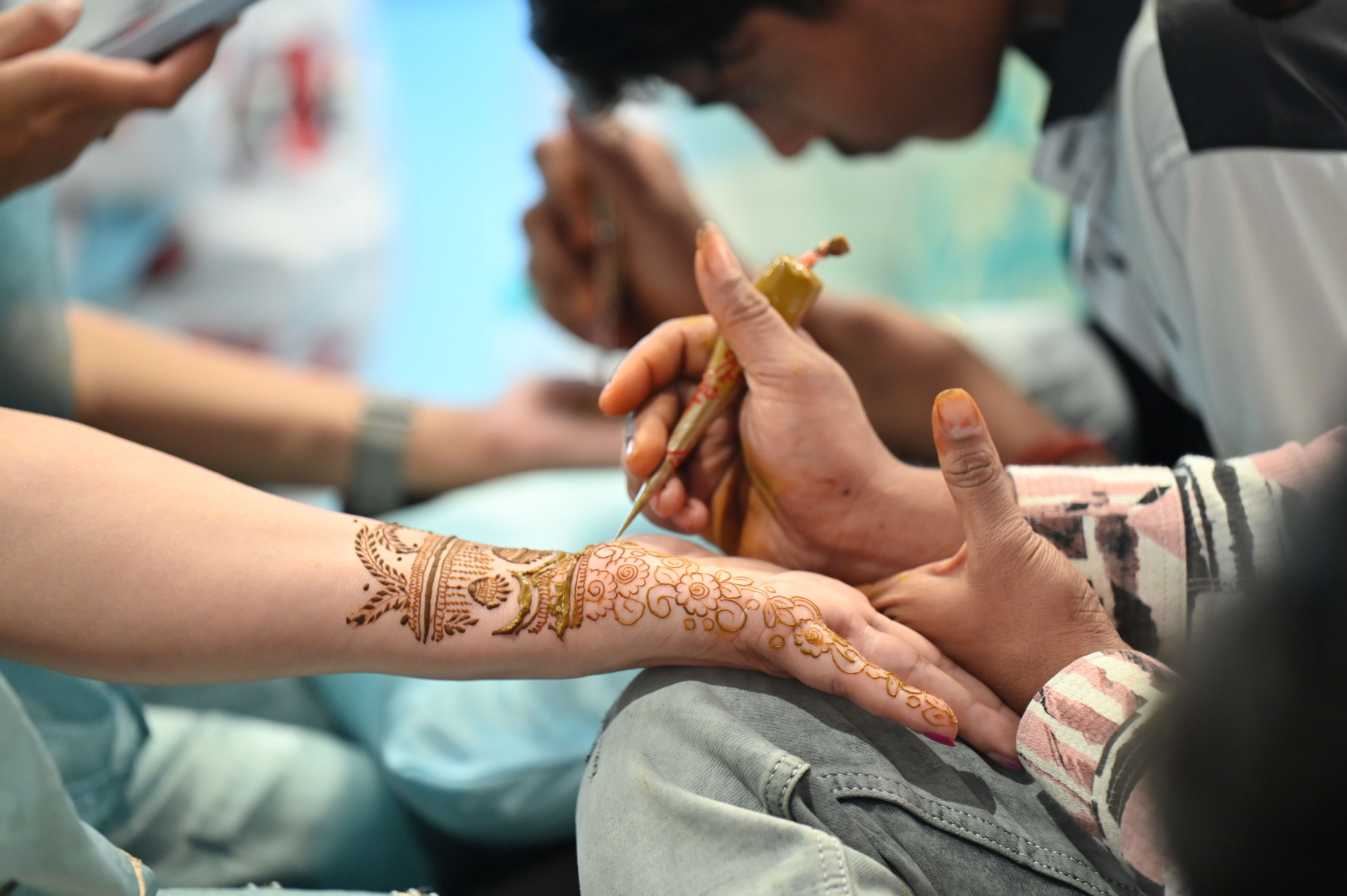 Henna Artist Applying Intricate Mehndi Design · Free Stock Photo