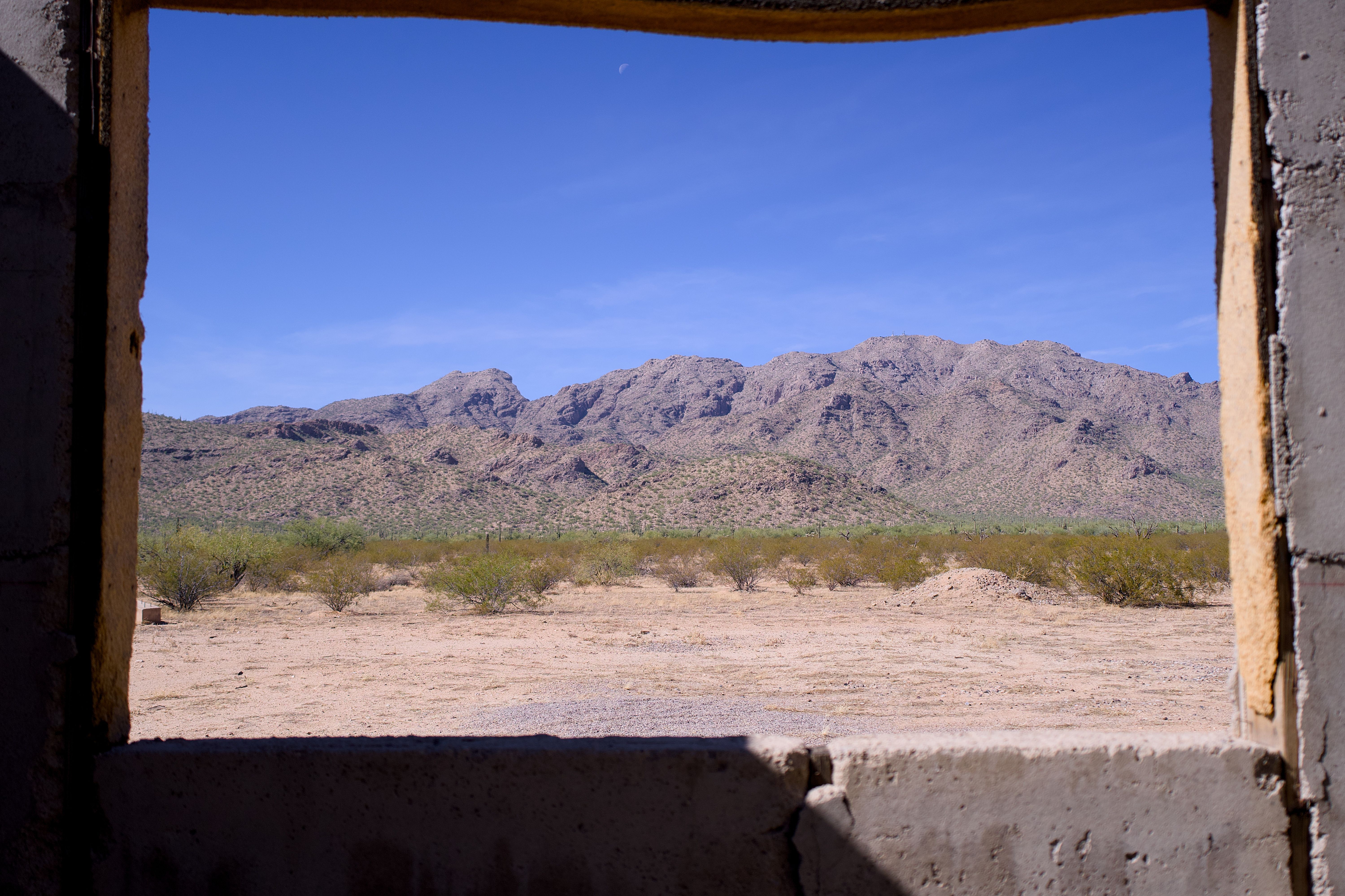 Desert Mountain View through Rustic Window Frame · Free Stock Photo
