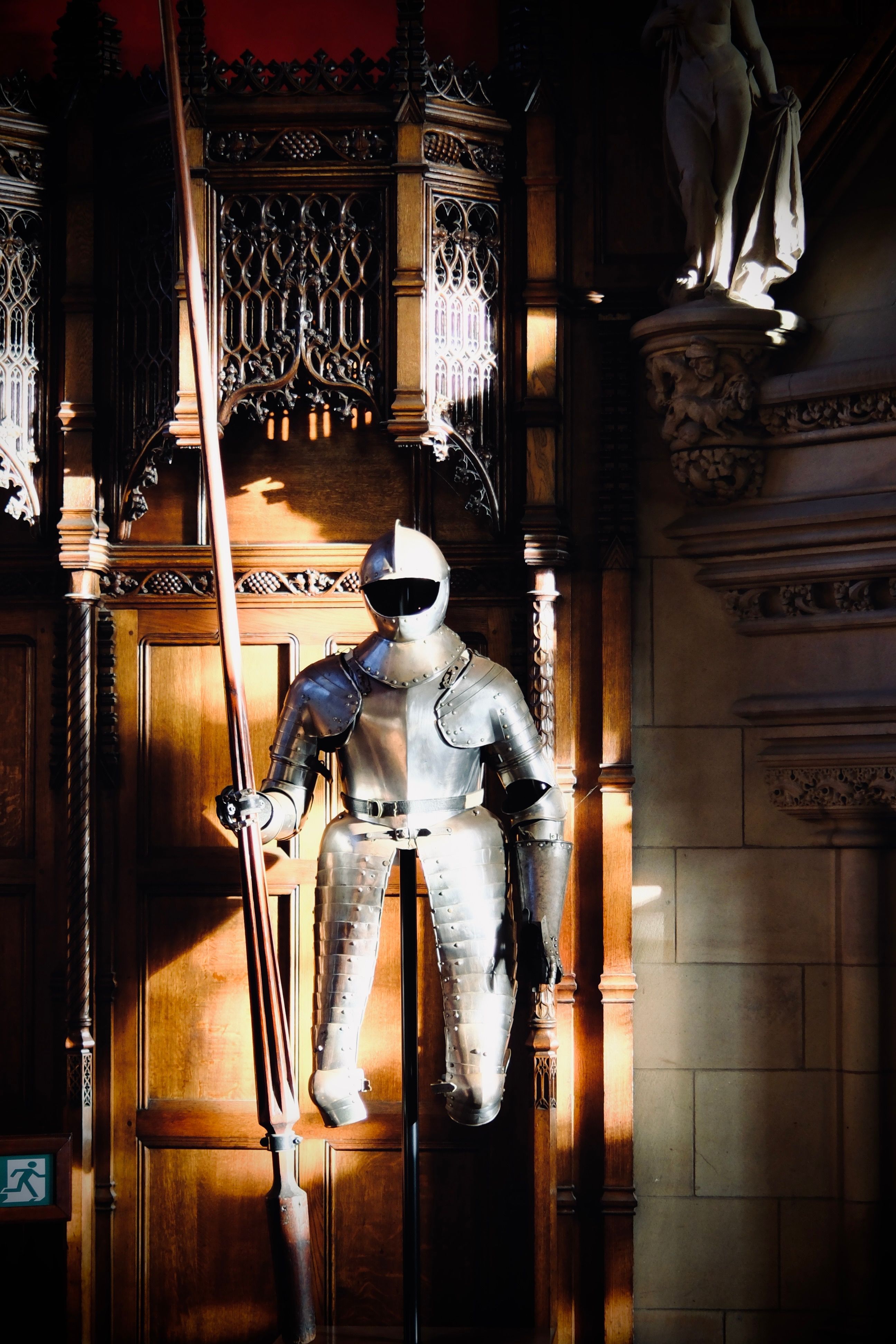 Medieval Knight Armor in Castle Hallway · Free Stock Photo