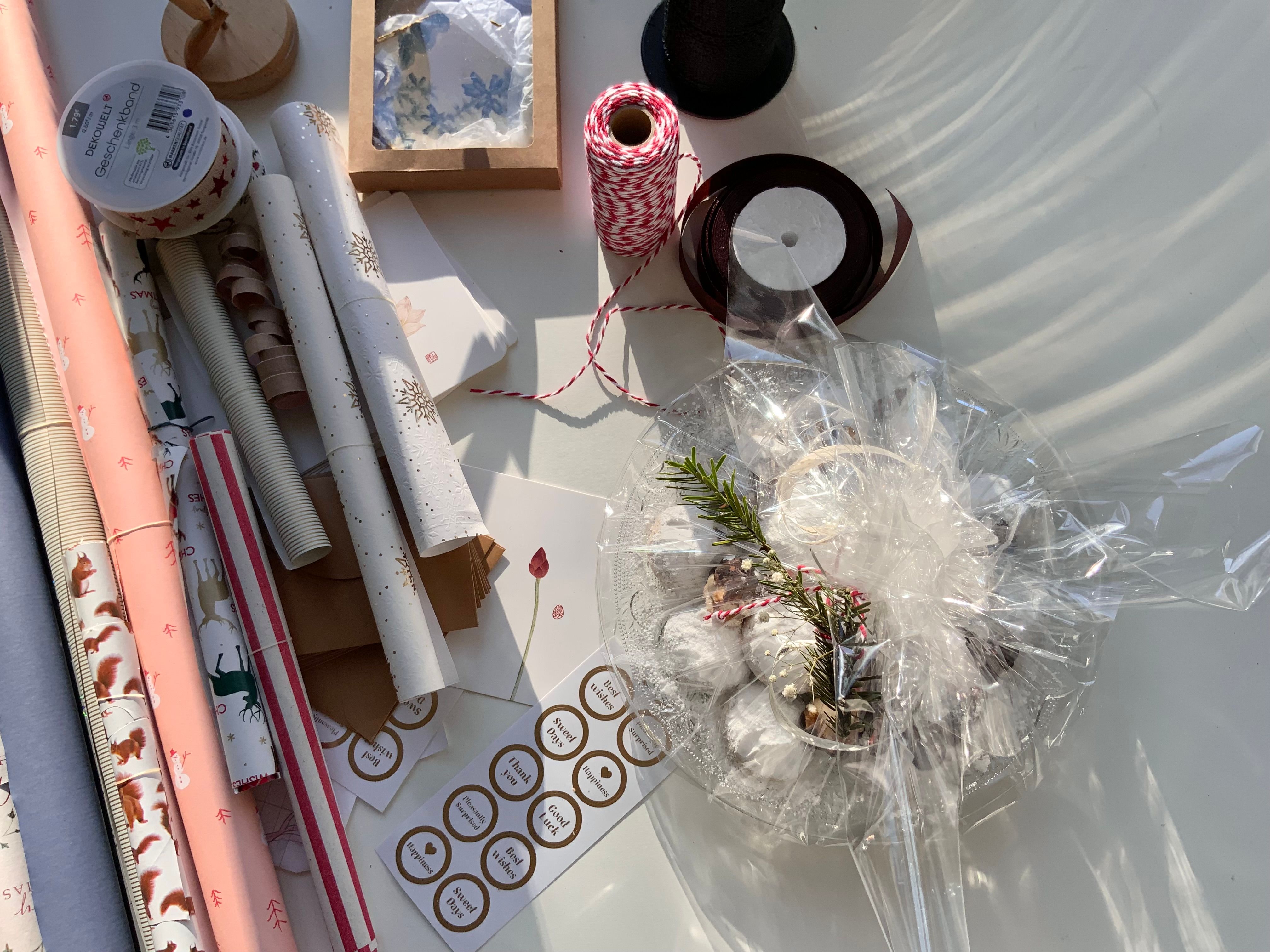 Creative Gift Wrapping Essentials in Sunlit Setting · Free Stock Photo