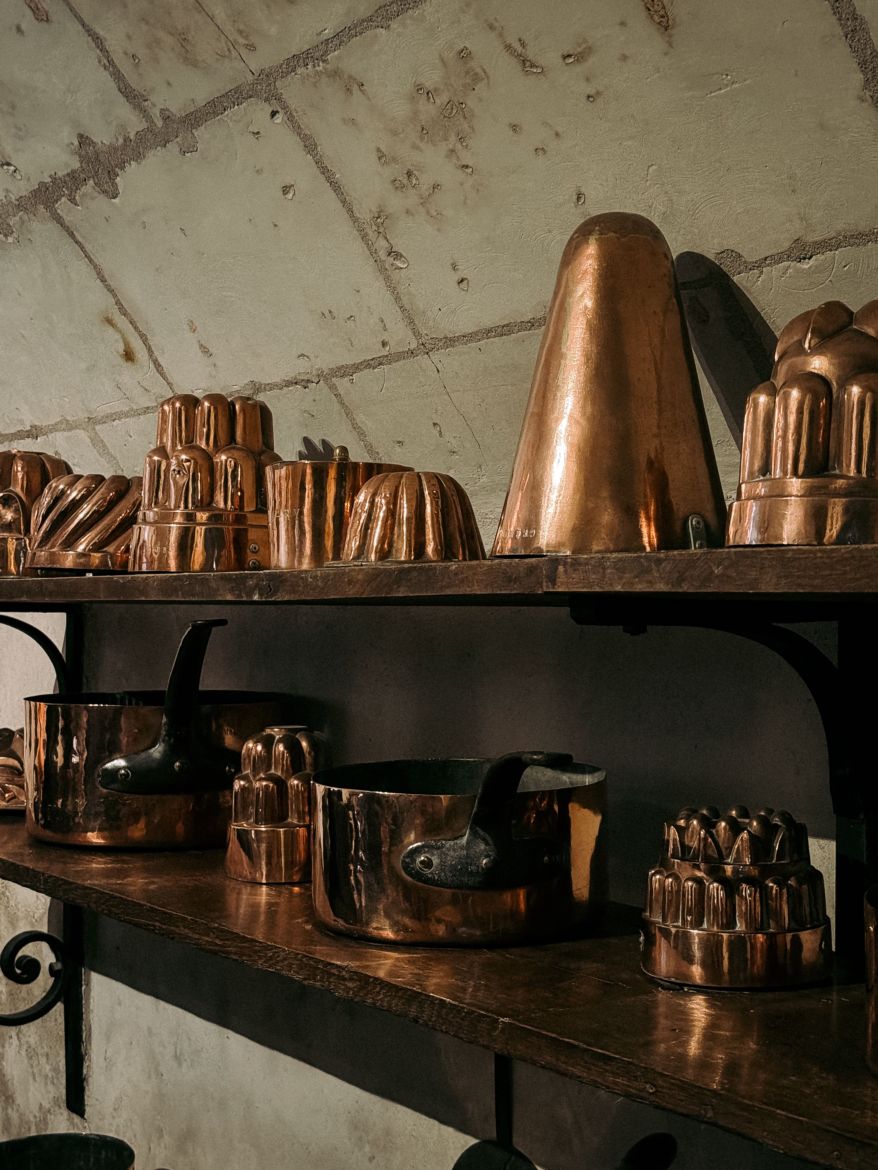 Vintage Copper Cookware Display in Rustic Kitchen · Free Stock Photo