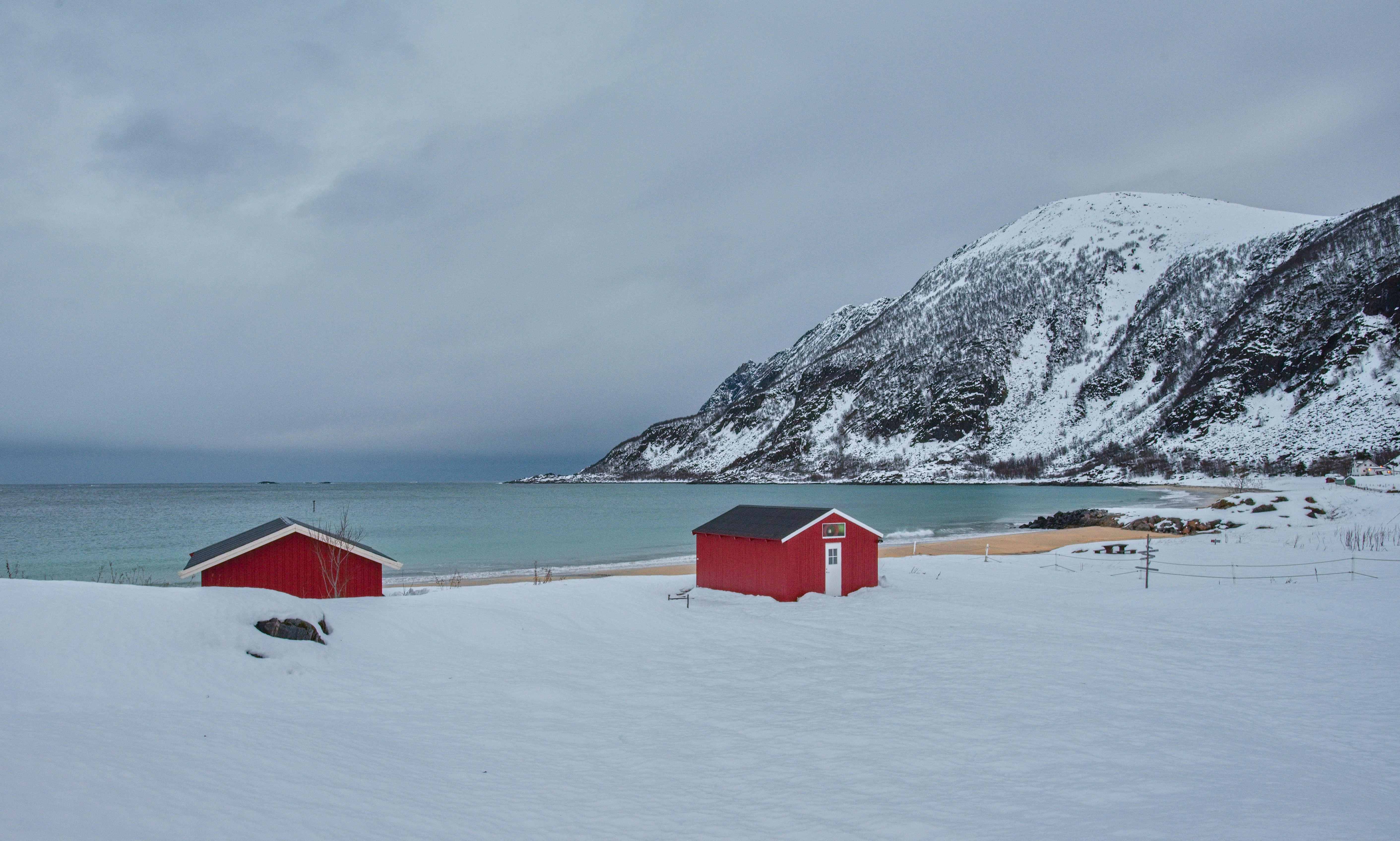 Stunning Winter Landscape with Red Cabins in Tromsø · Free Stock Photo
