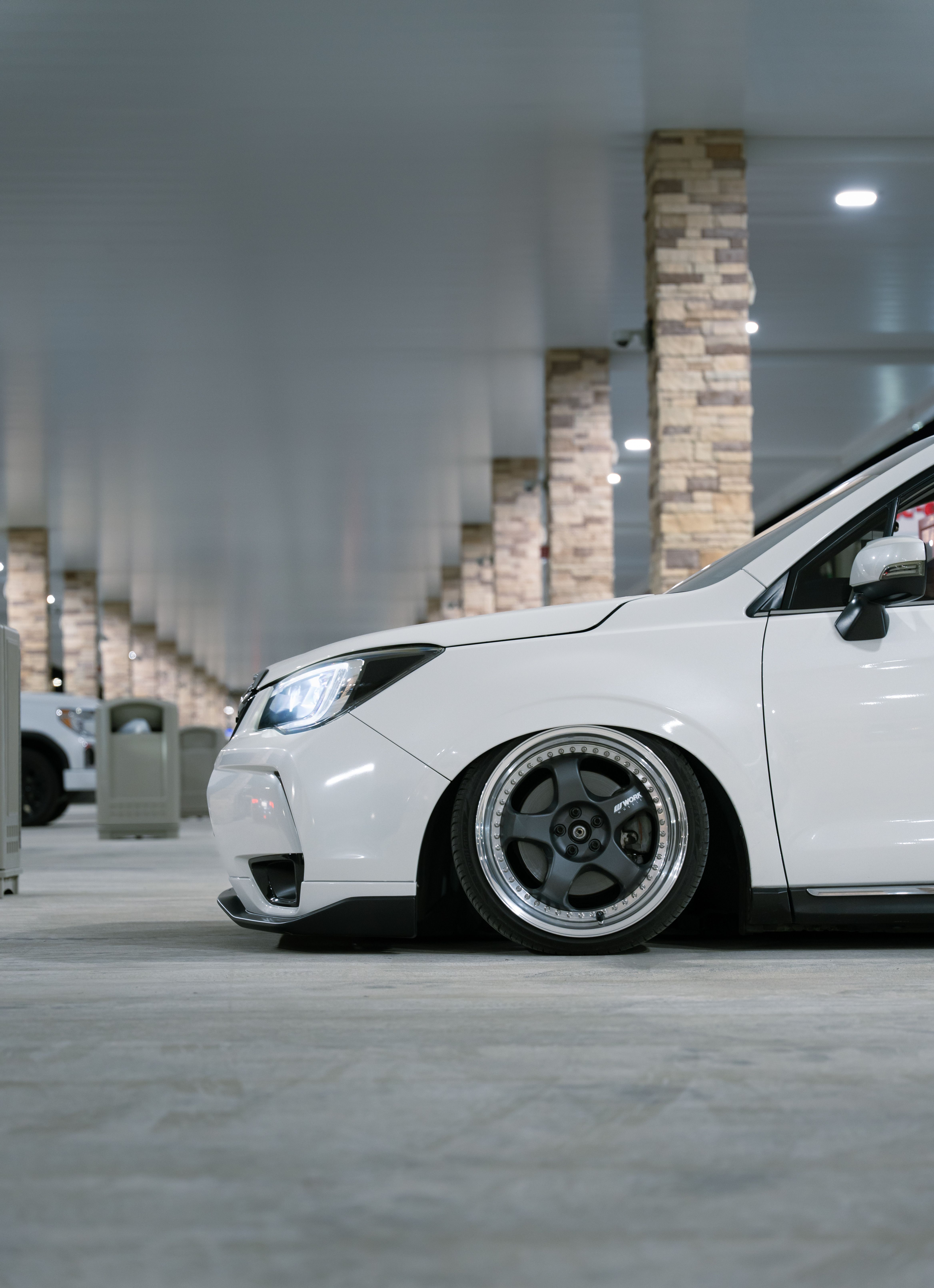 Sleek Silver Car with Custom Rims at Night · Free Stock Photo