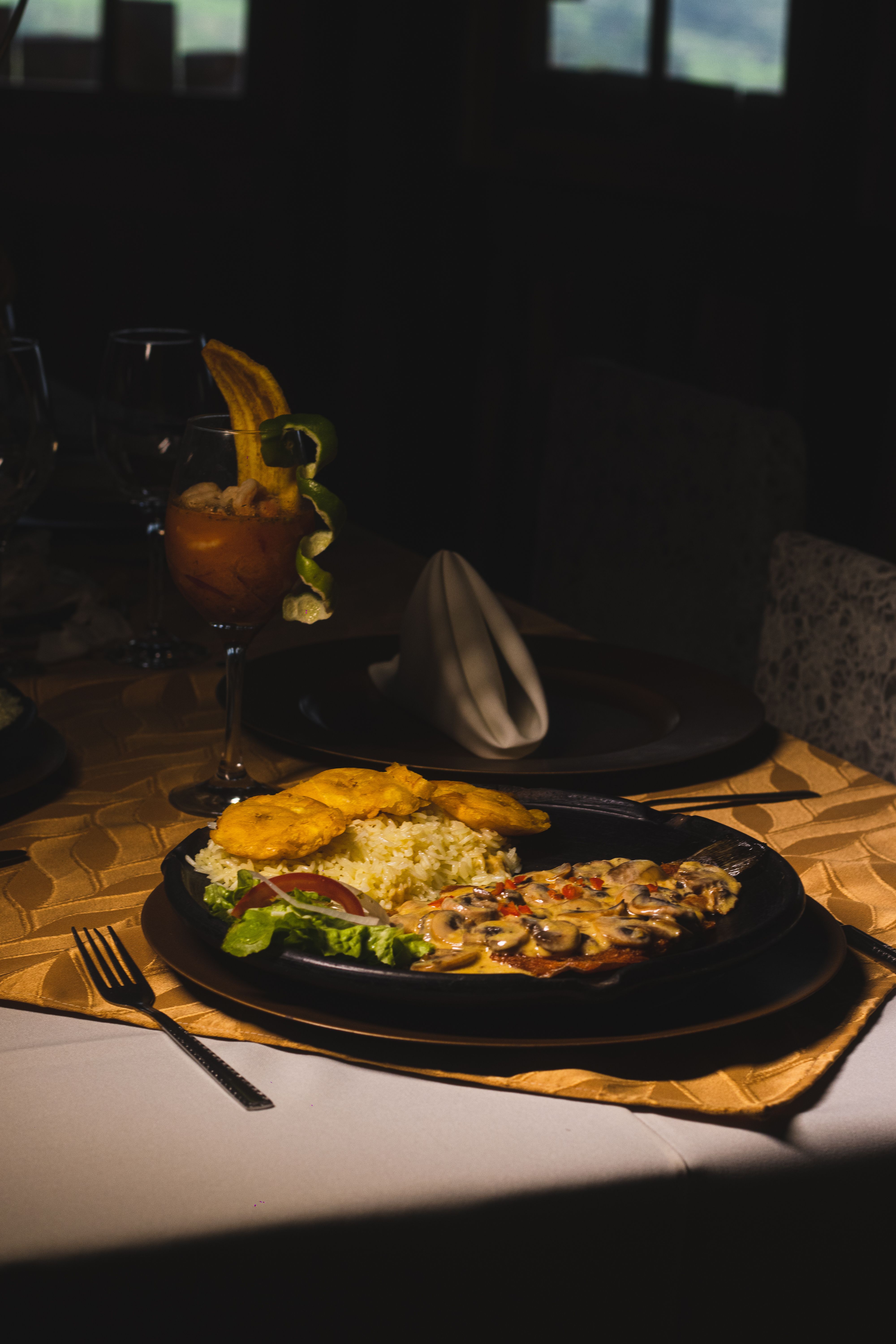 Gourmet Dinner Presentation in Dim Lighting · Free Stock Photo