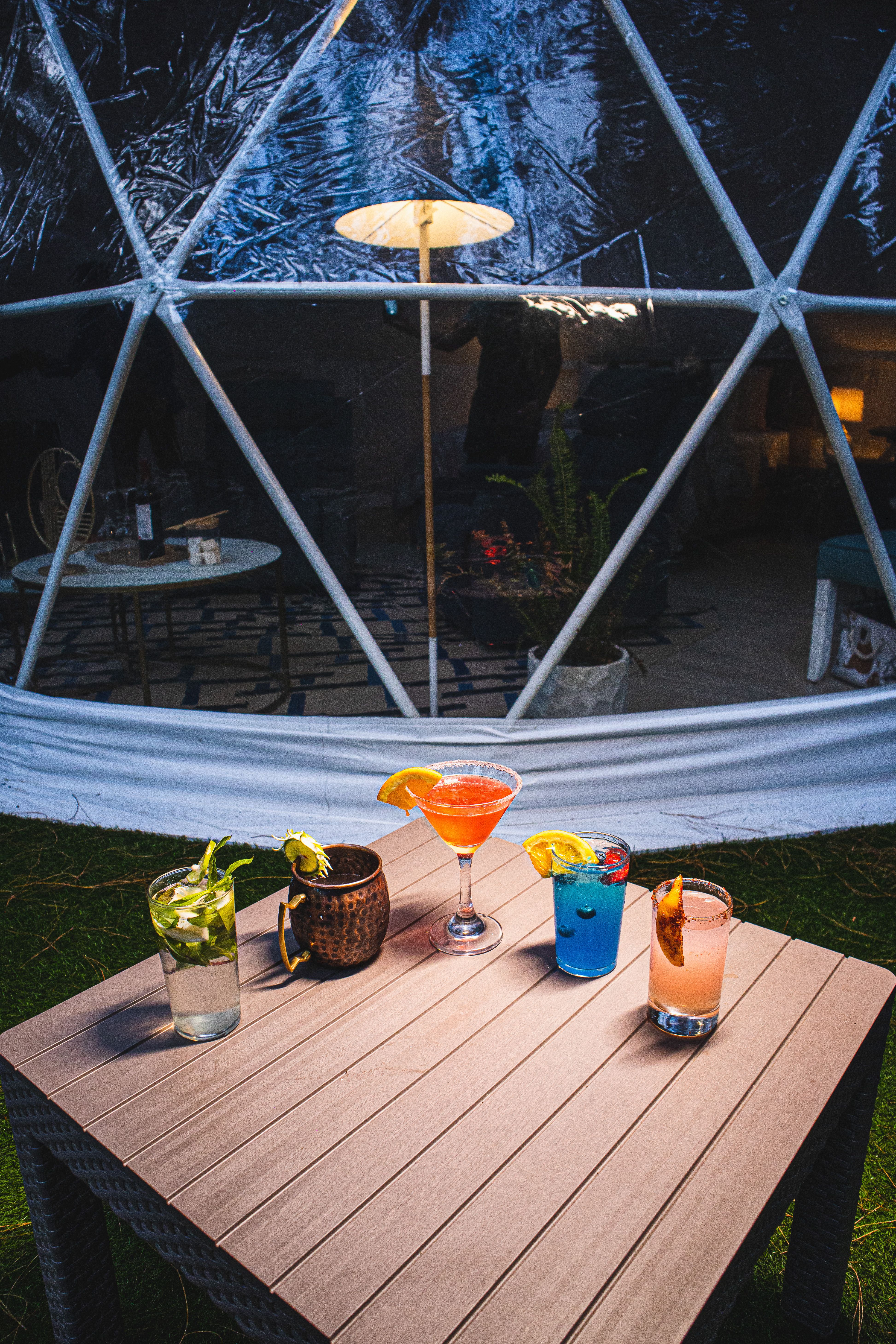 Colorful Cocktails on Outdoor Table at Night · Free Stock Photo