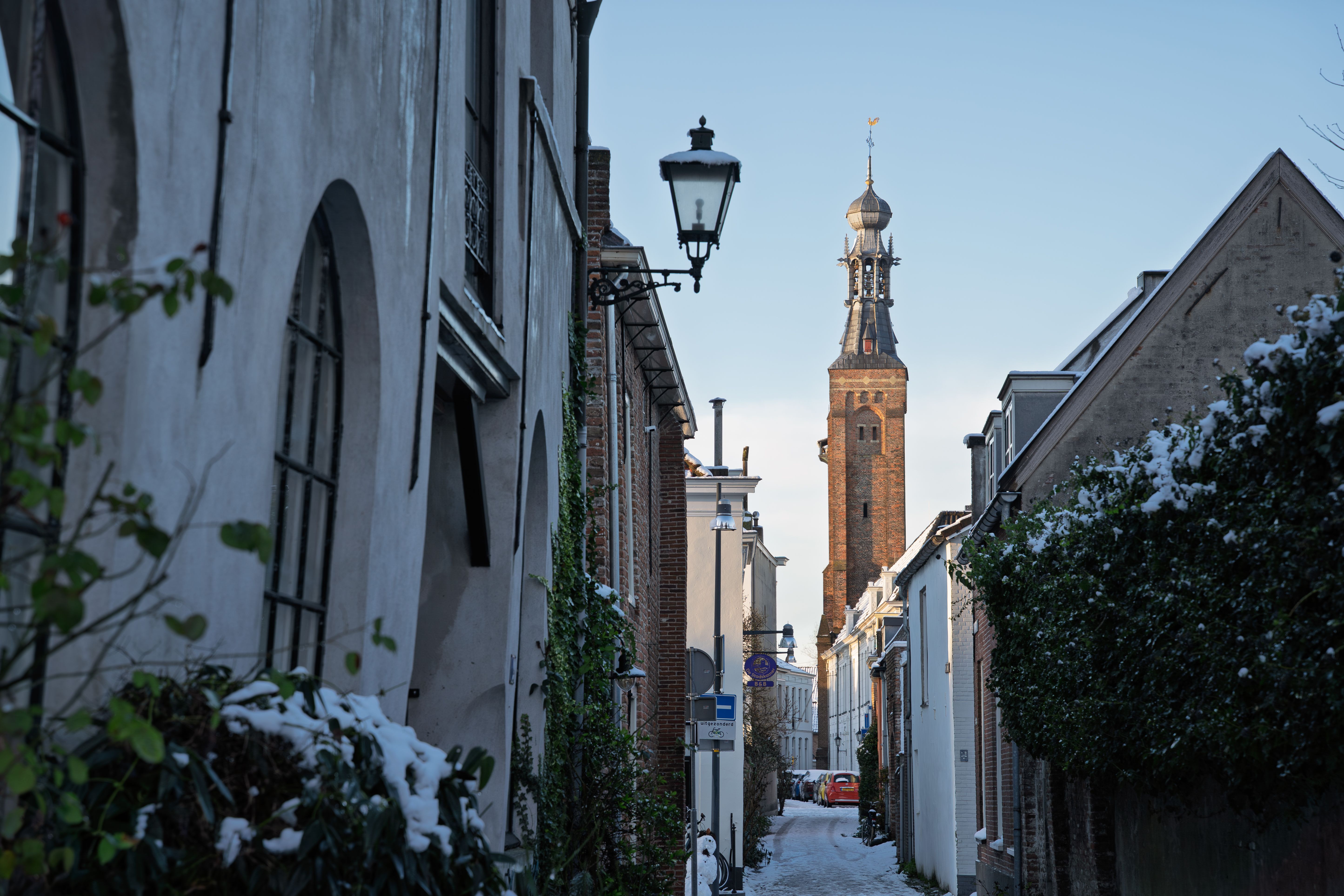 Winter Street View with Historic Tower in Europe · Free Stock Photo