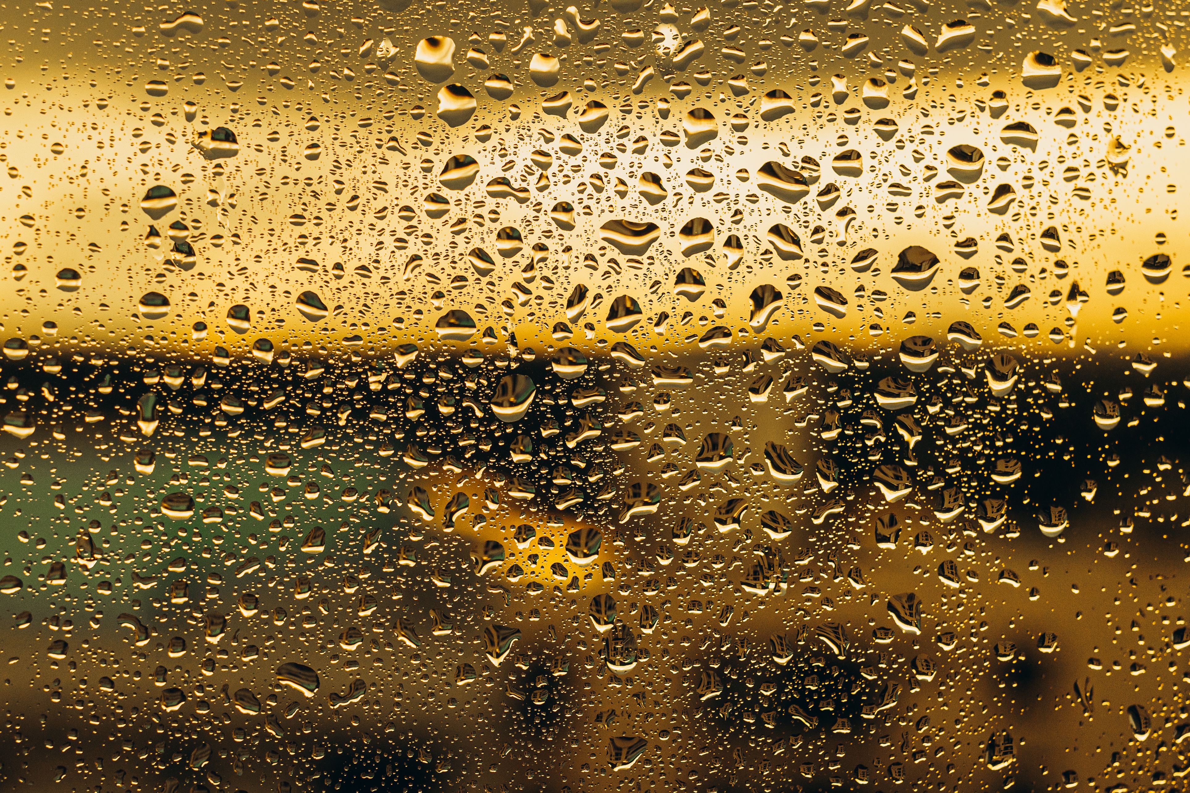 Golden Raindrops on a Window Pane at Sunset · Free Stock Photo