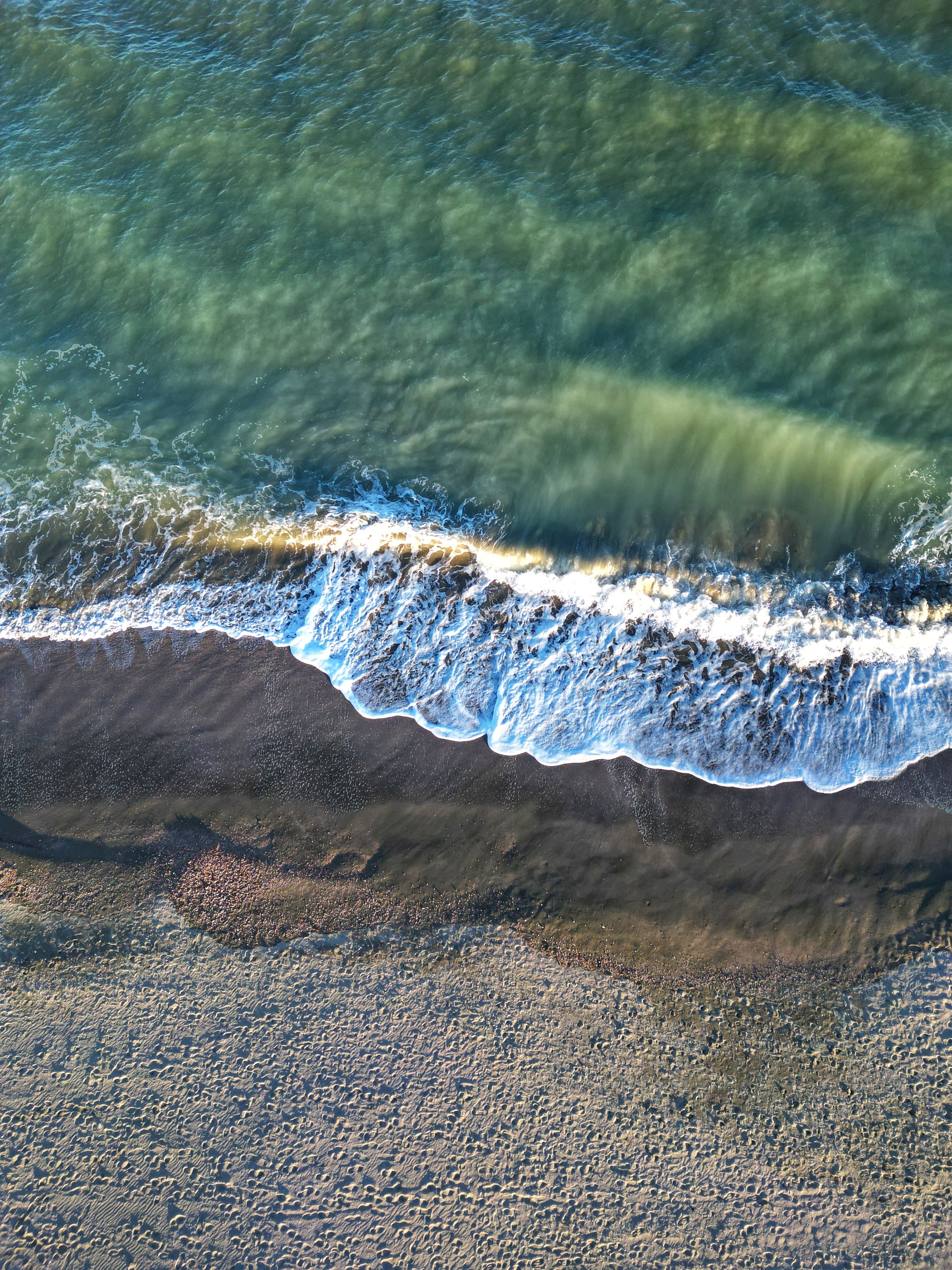 Stunning Aerial View of Ocean Waves on Beach · Free Stock Photo
