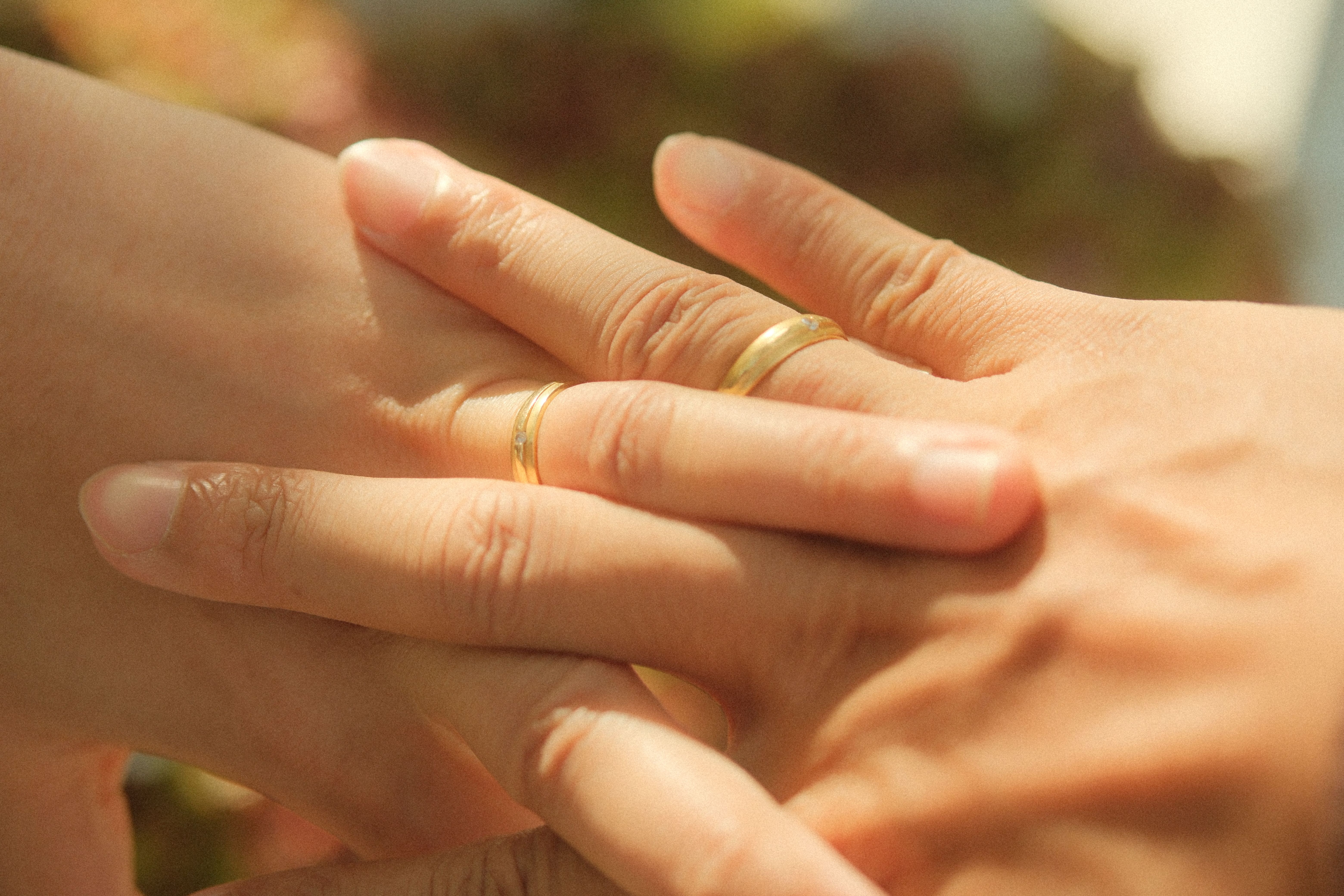 Close-up of Joined Hands with Wedding Rings · Free Stock Photo
