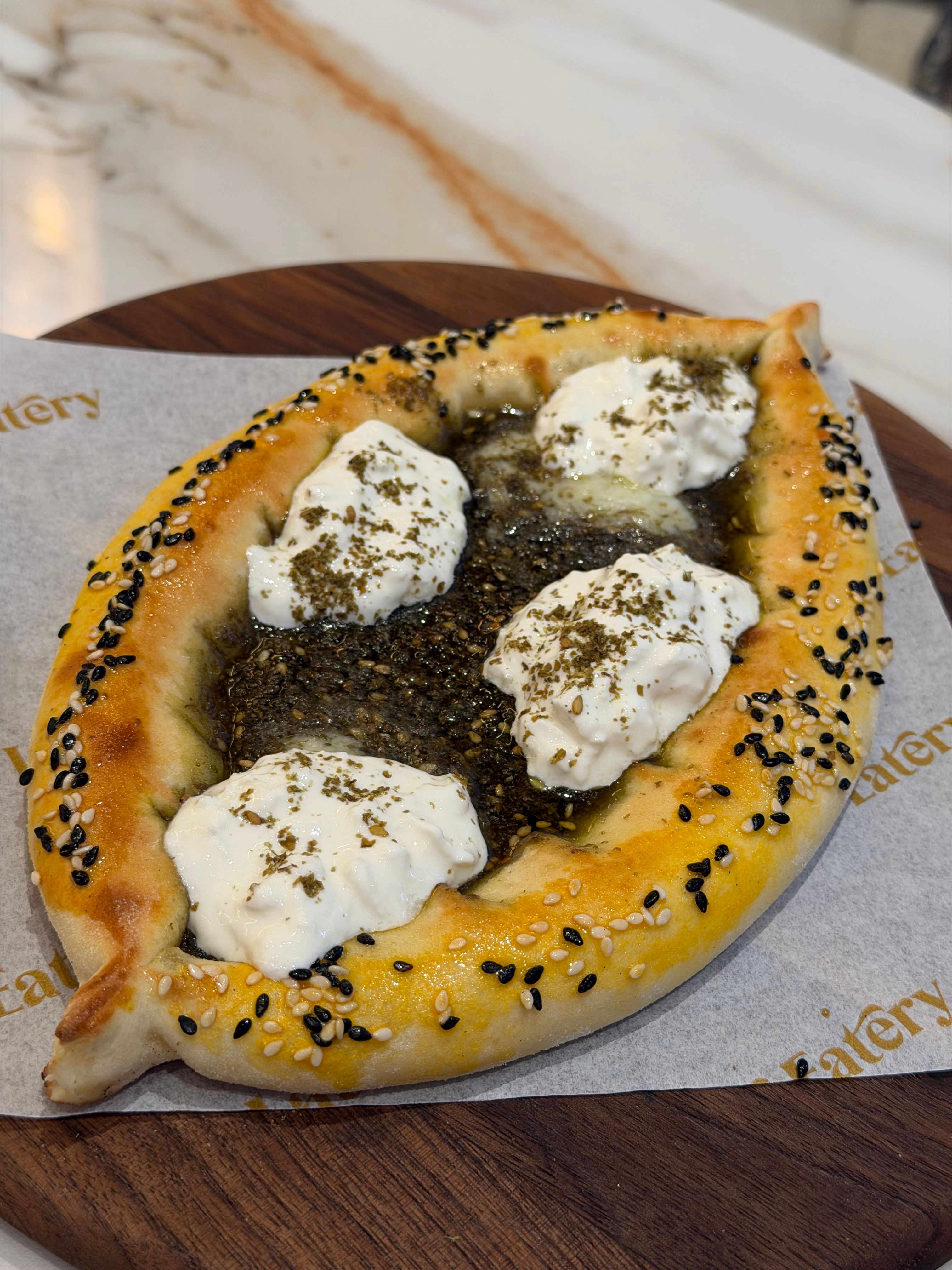 Delicious Zaatar Bread with Cream Cheese on Wooden Board · Free Stock Photo