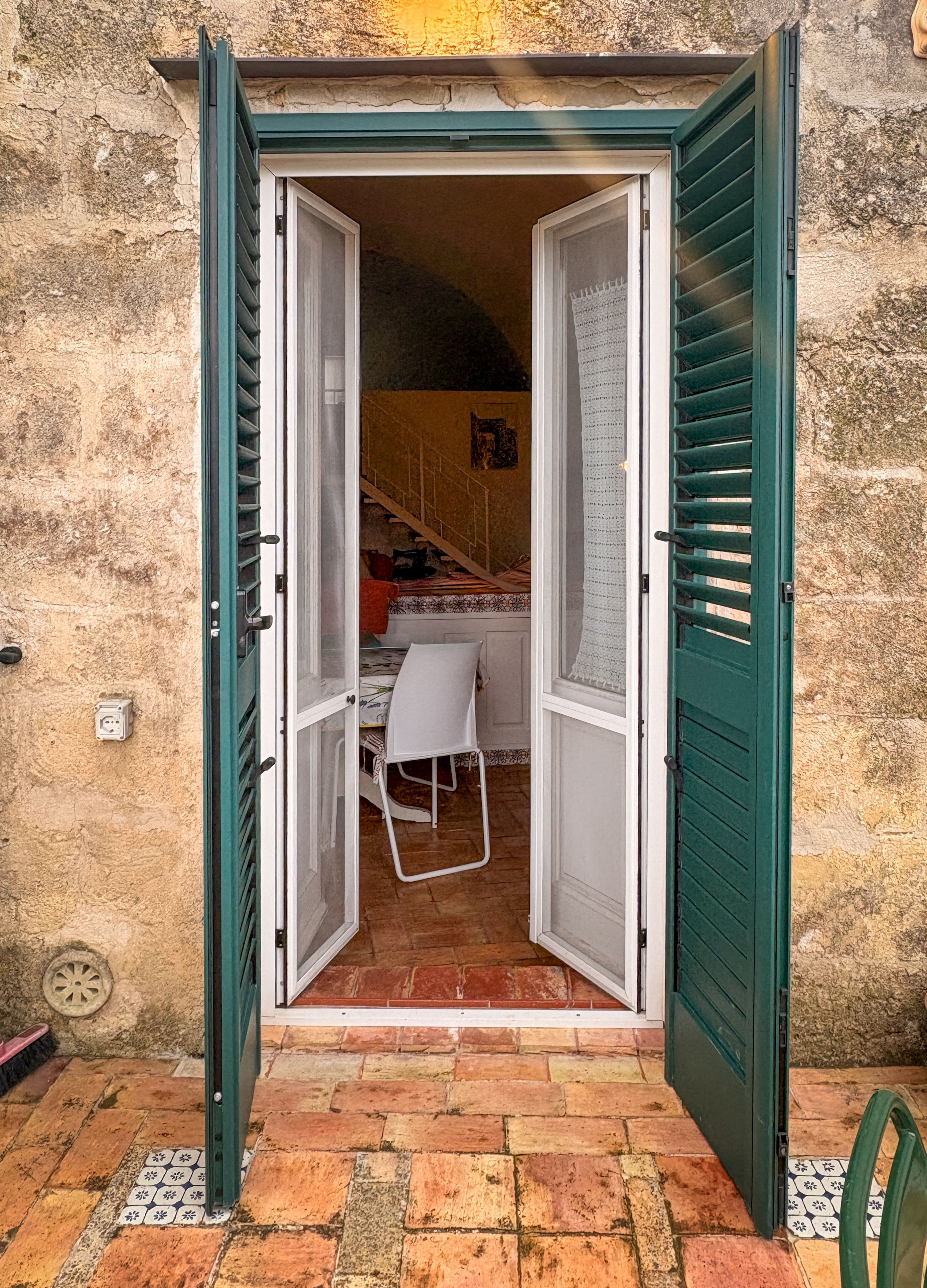 Inviting Open Doorway in Rustic Stone House · Free Stock Photo