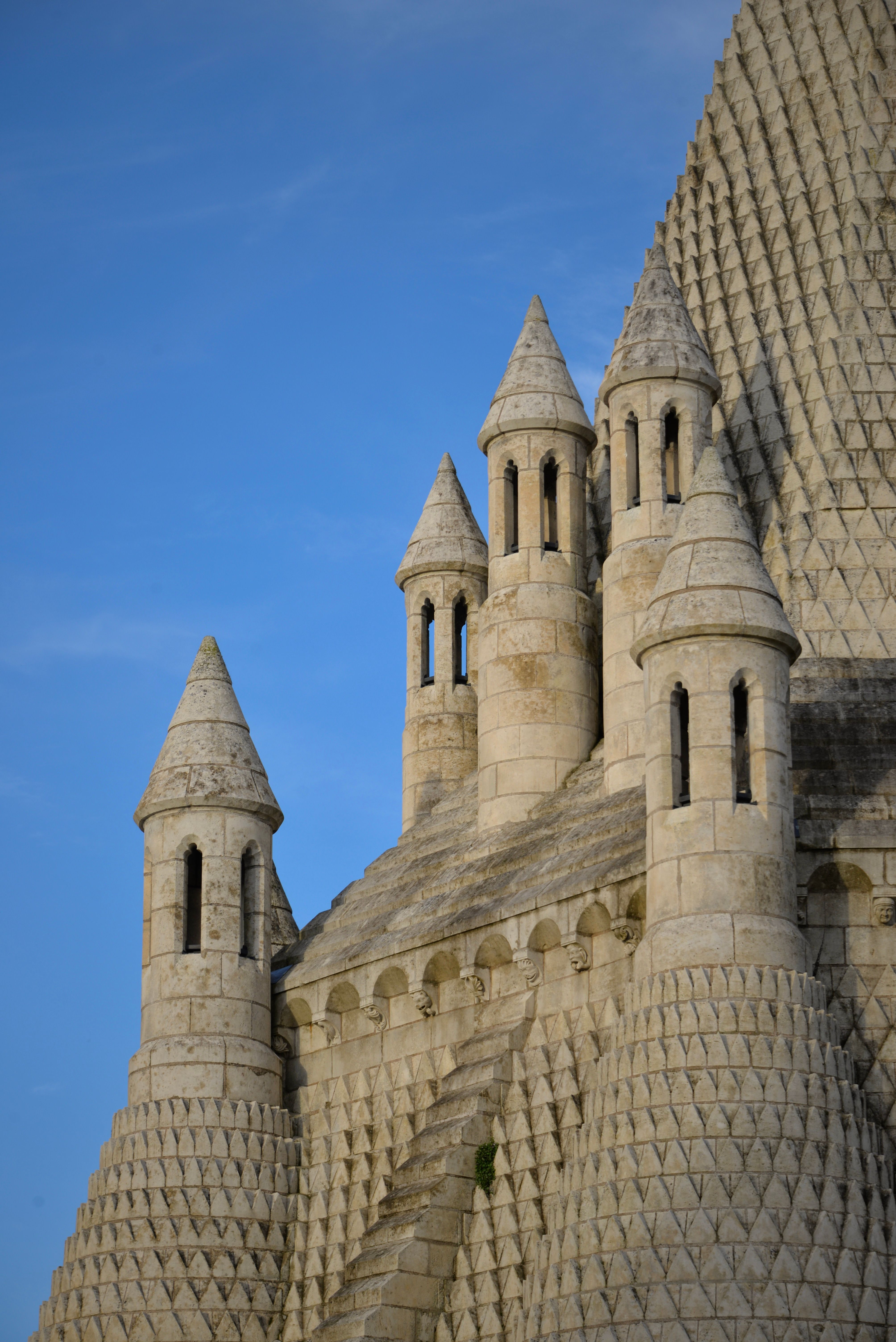 Detailed Stone Spires of Fontevraud Abbey · Free Stock Photo