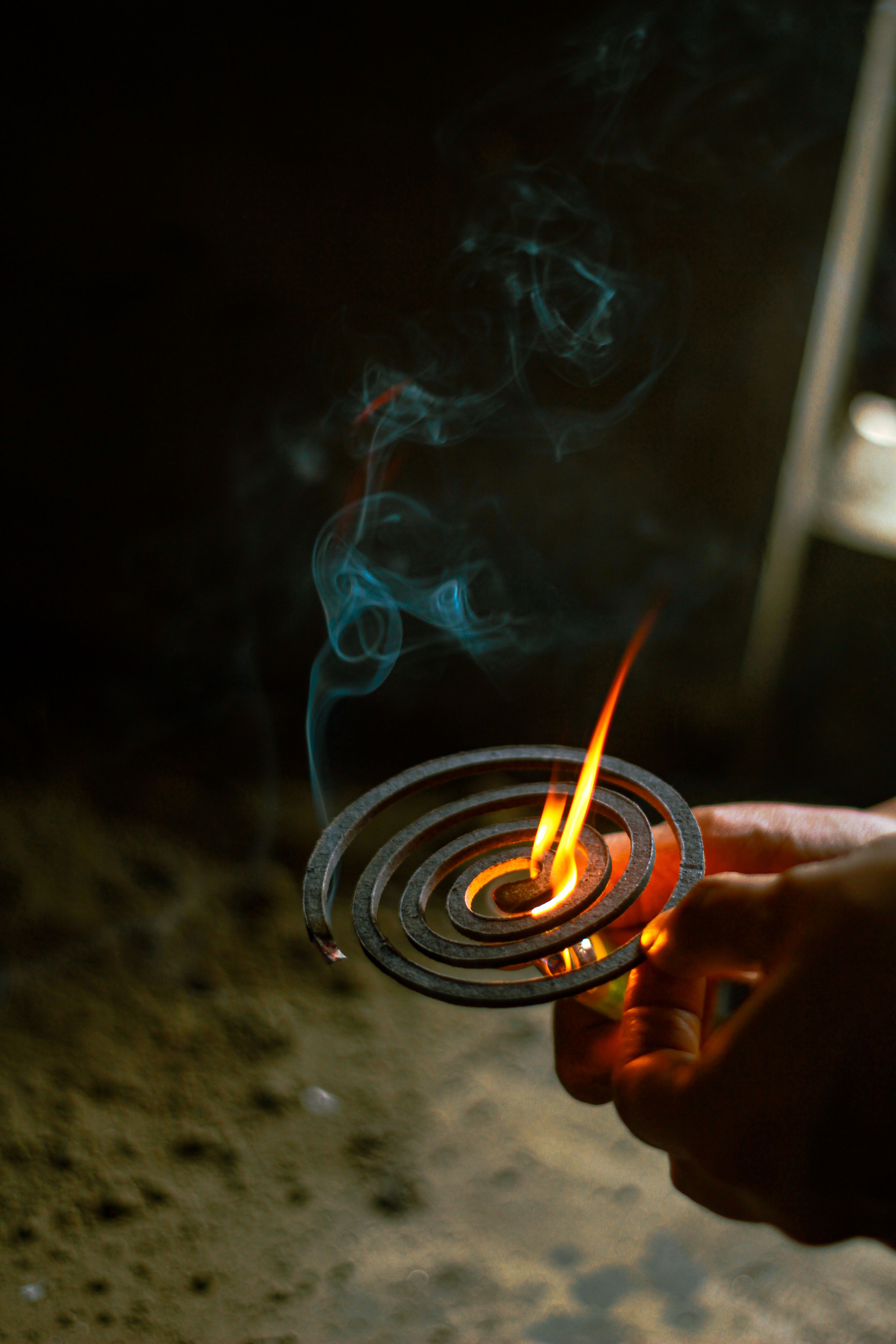 Burning Mosquito Coil with Rising Smoke in Dhaka · Free Stock Photo