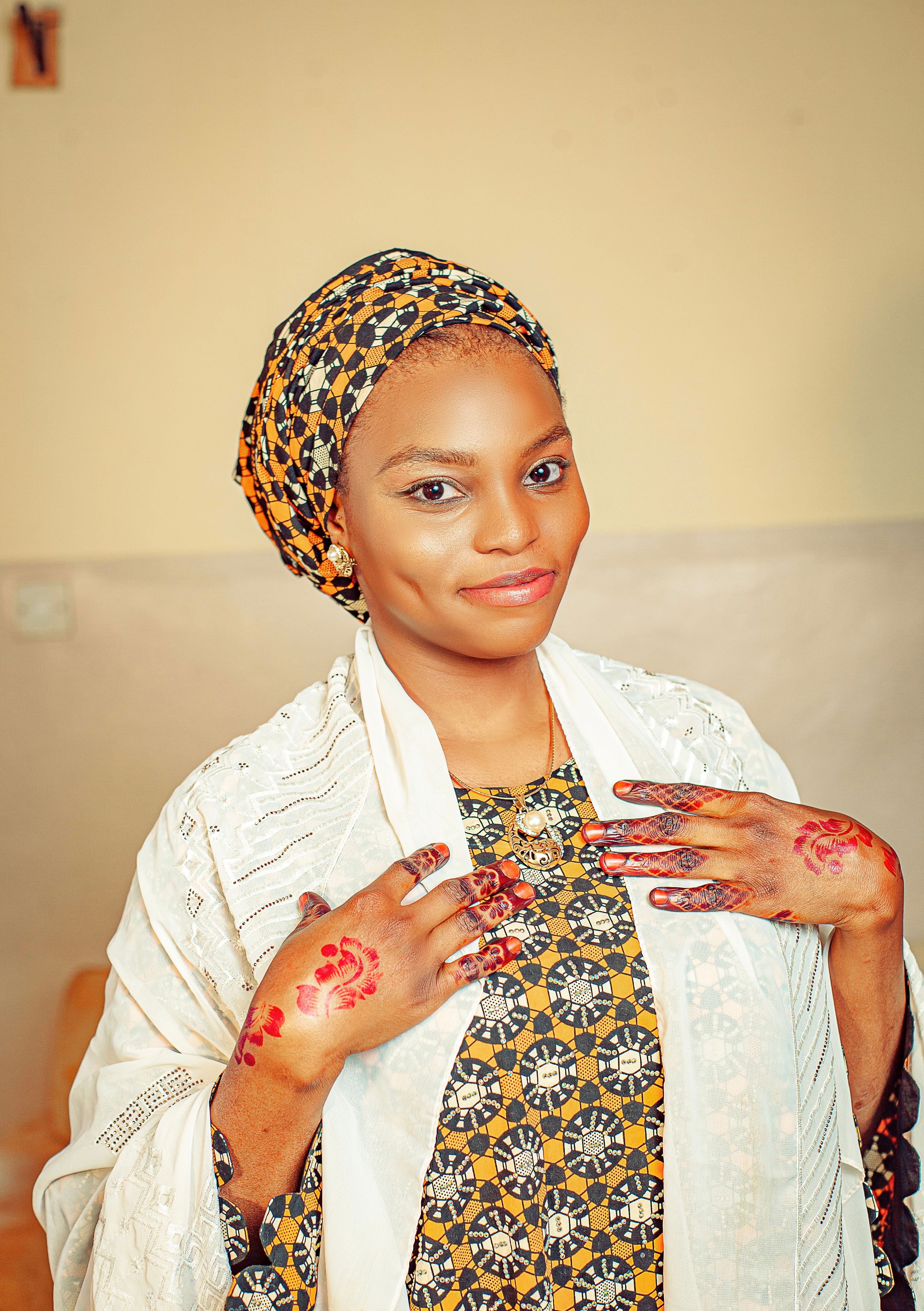 Young Woman in Traditional African Attire with Henna · Free Stock Photo