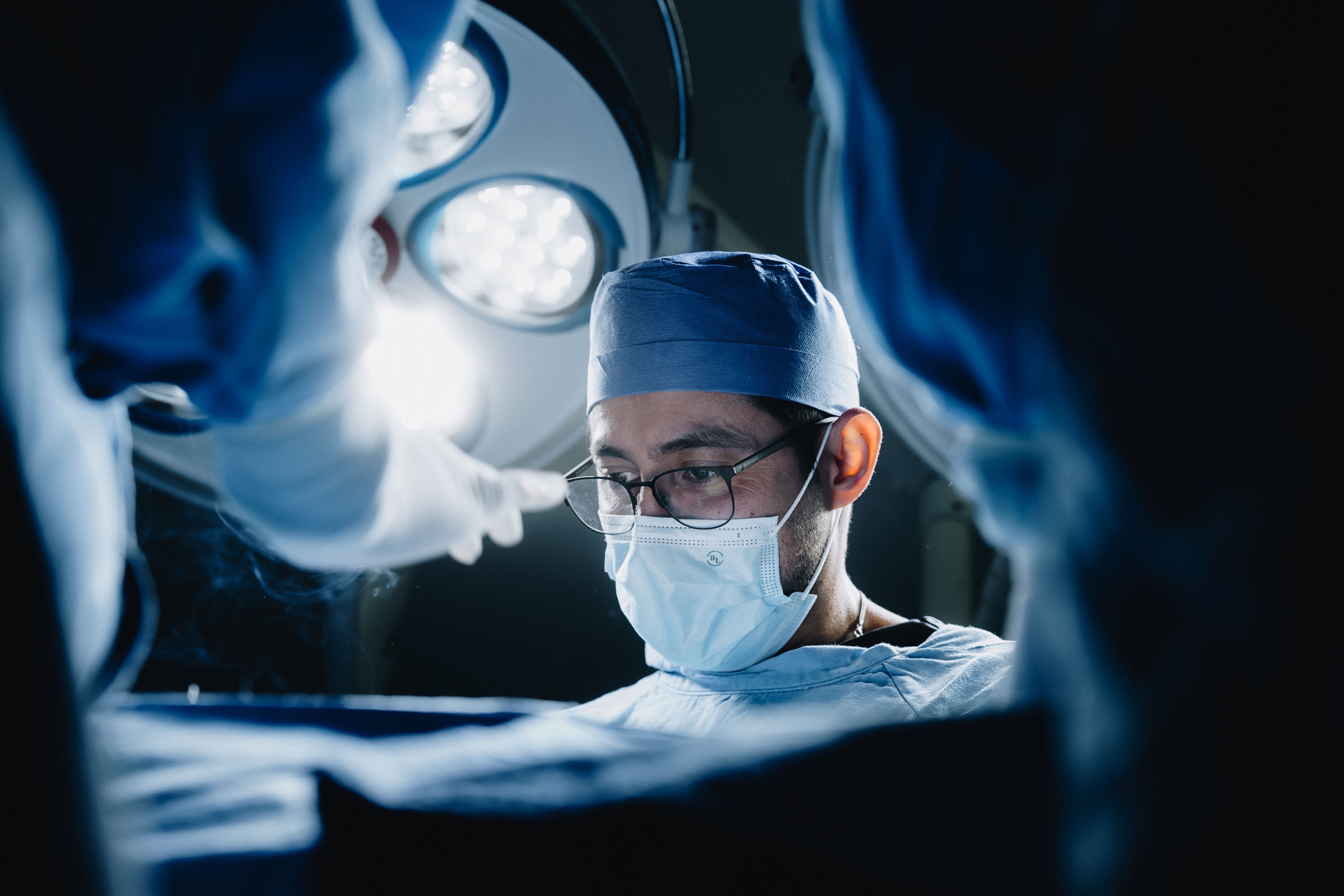 Surgeon performing operation in modern hospital · Free Stock Photo
