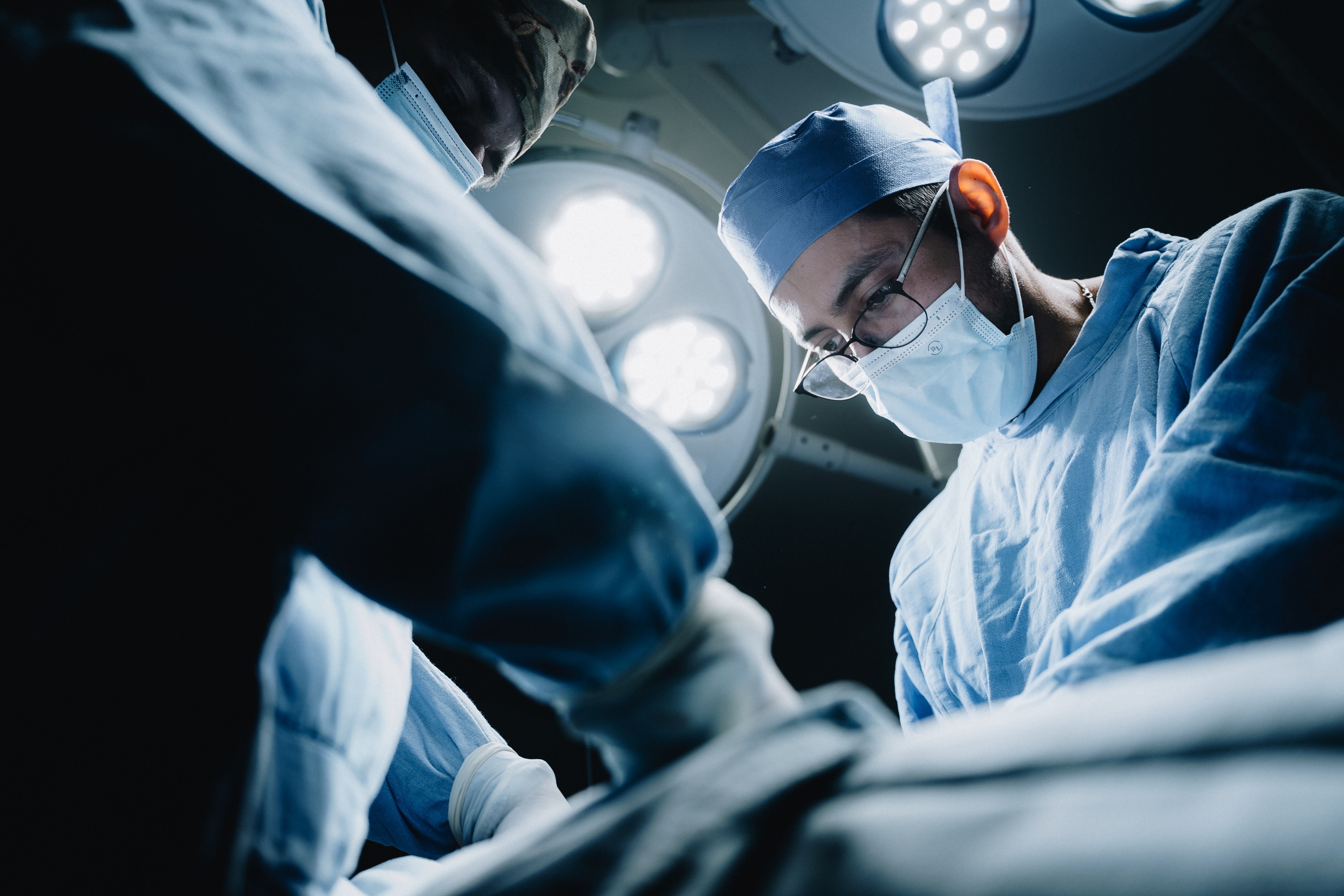 Surgeons Performing Procedure in Operating Room · Free Stock Photo