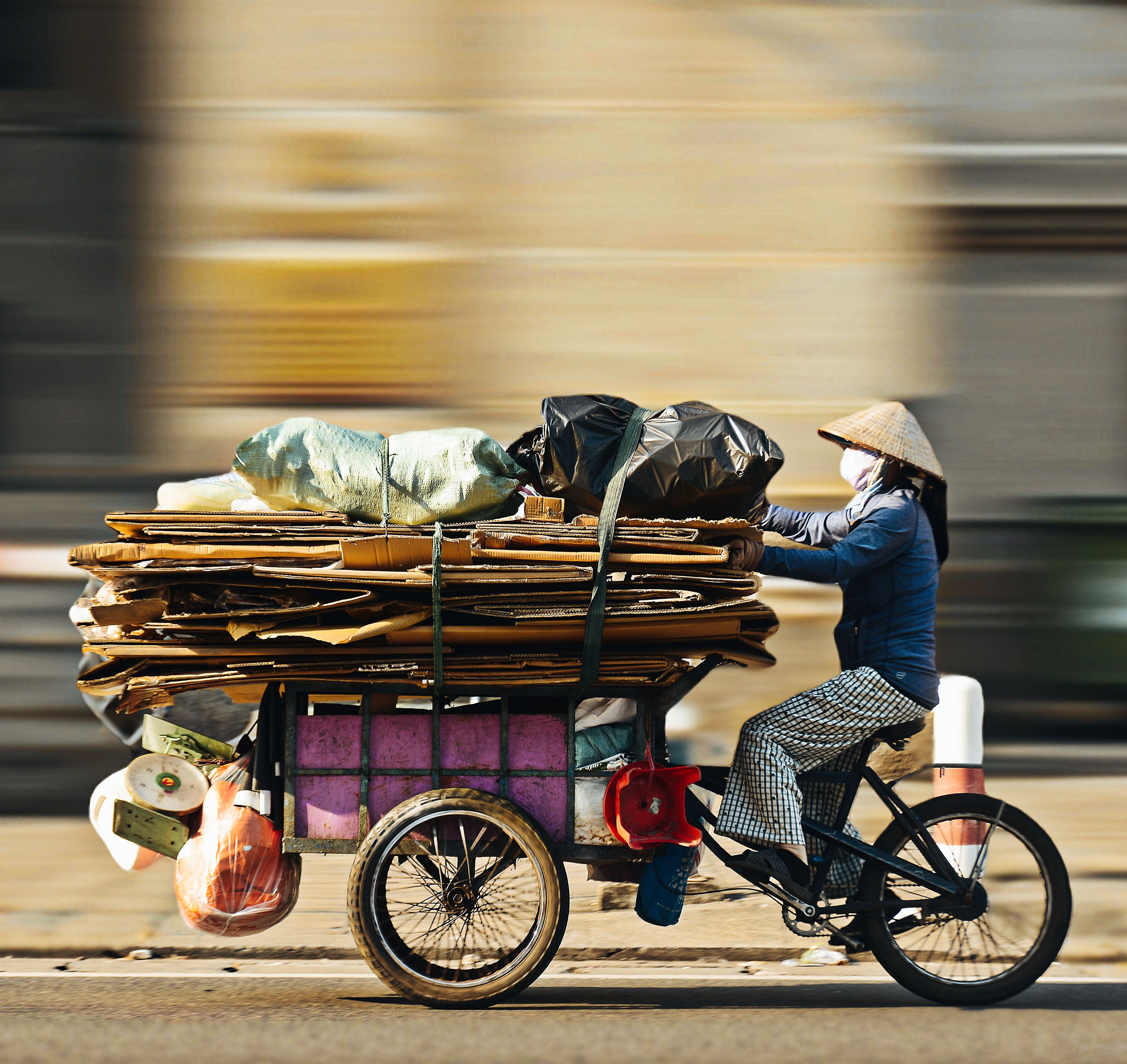 Man Riding Motorbike Loaded with Boxes in Saigon · Free Stock Photo