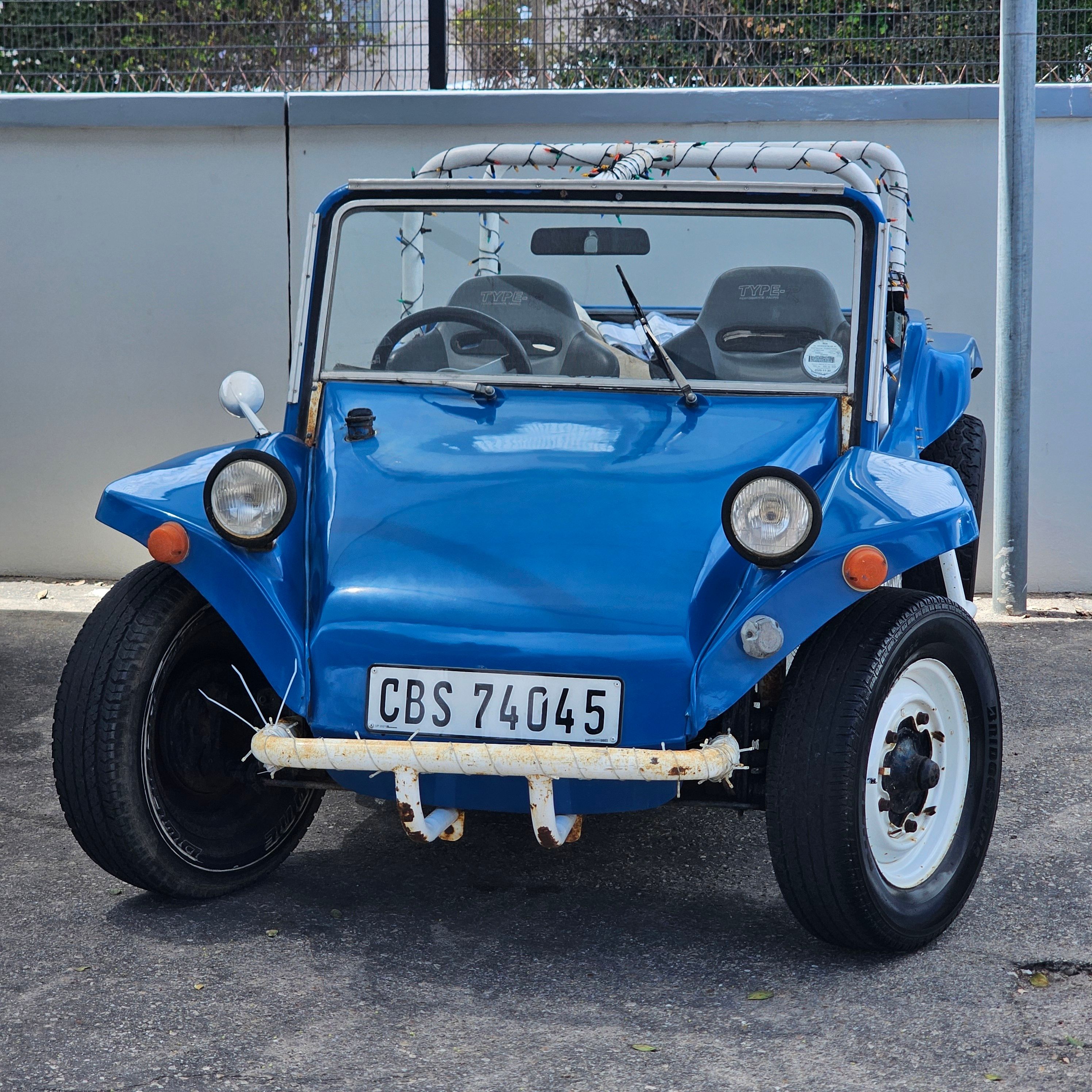 Vintage Blue Buggy Parked Outdoors · Free Stock Photo