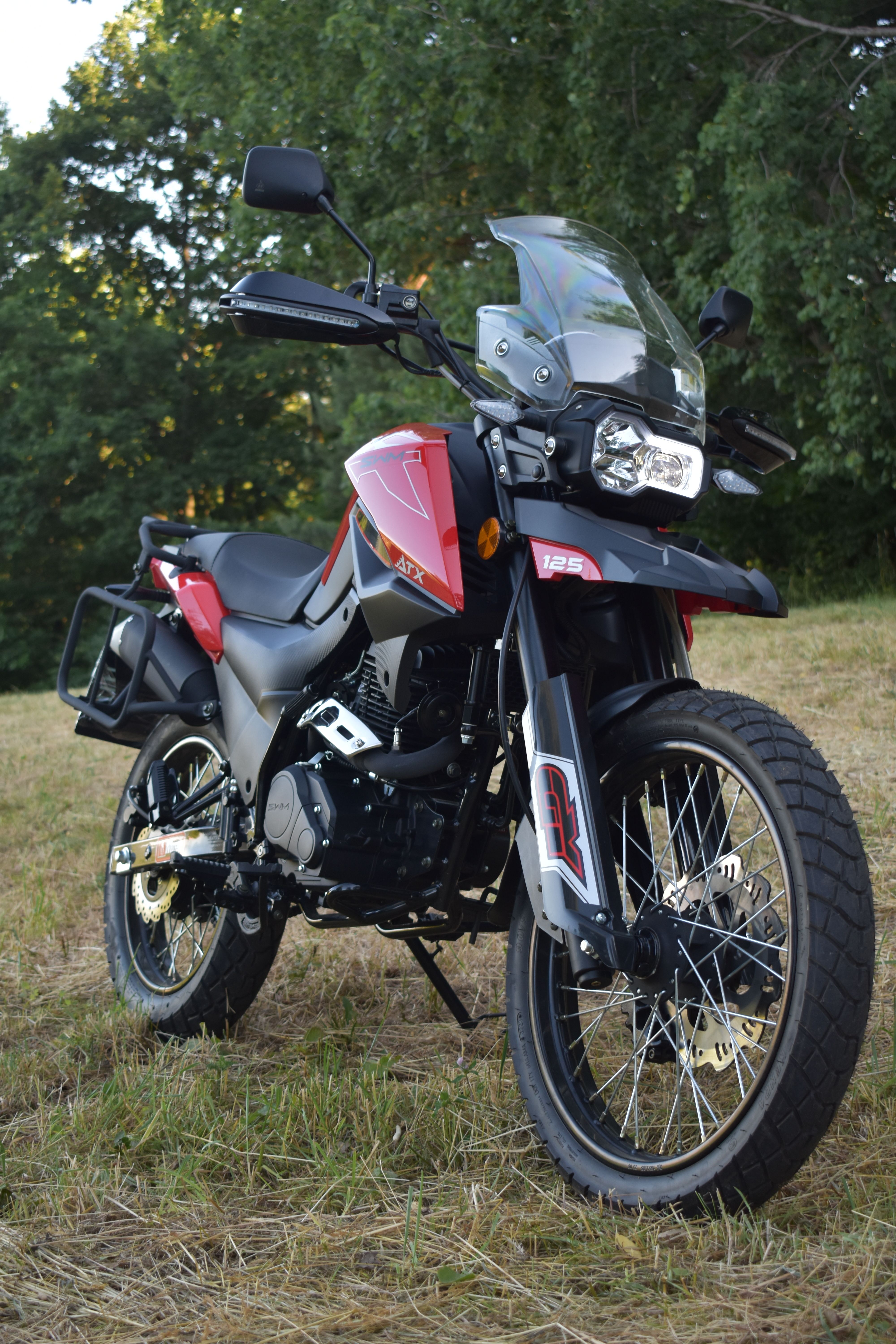 Red Adventure Motorcycle Parked Outdoors · Free Stock Photo