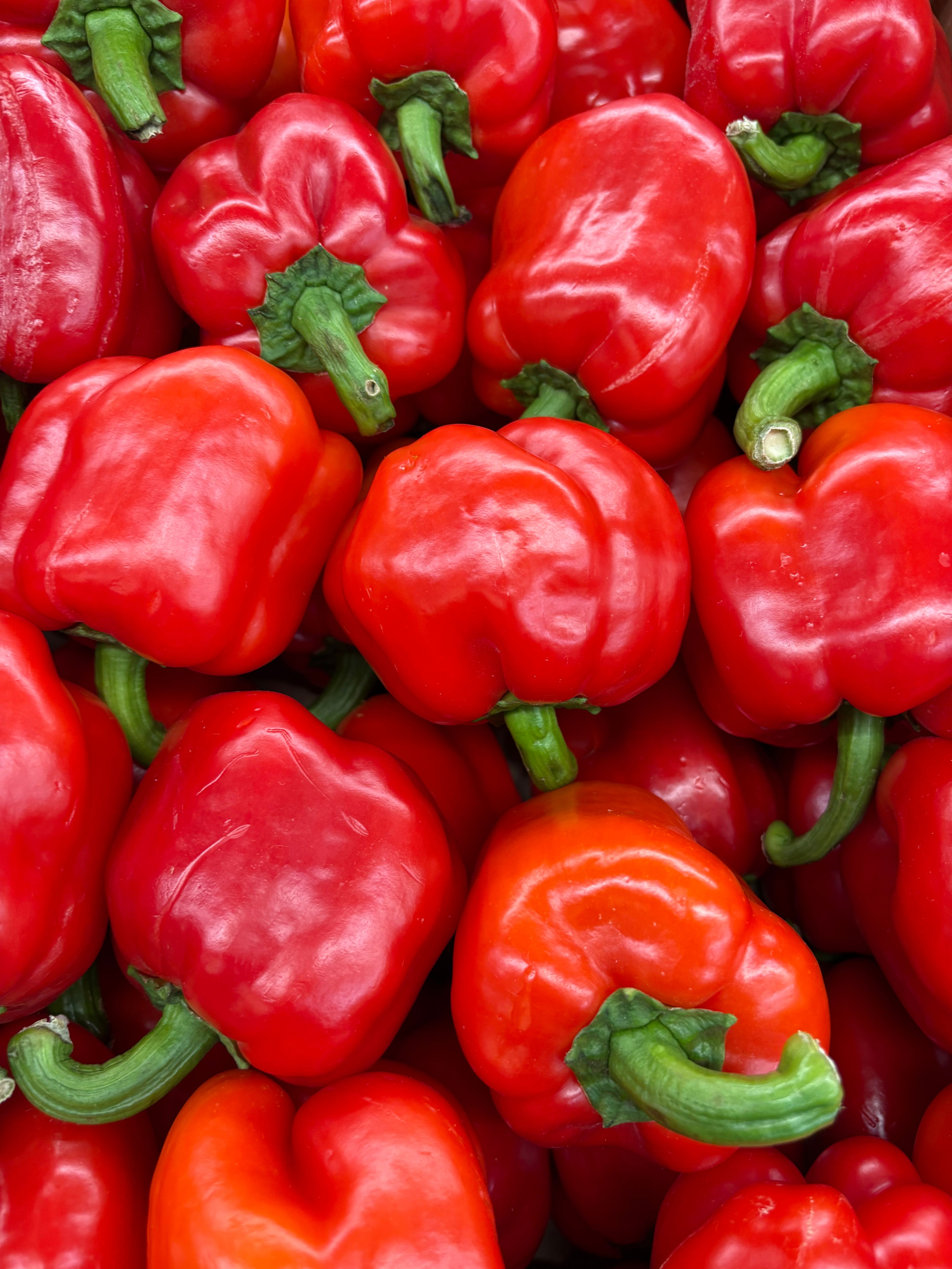 Fresh Red Bell Peppers at a Market · Free Stock Photo