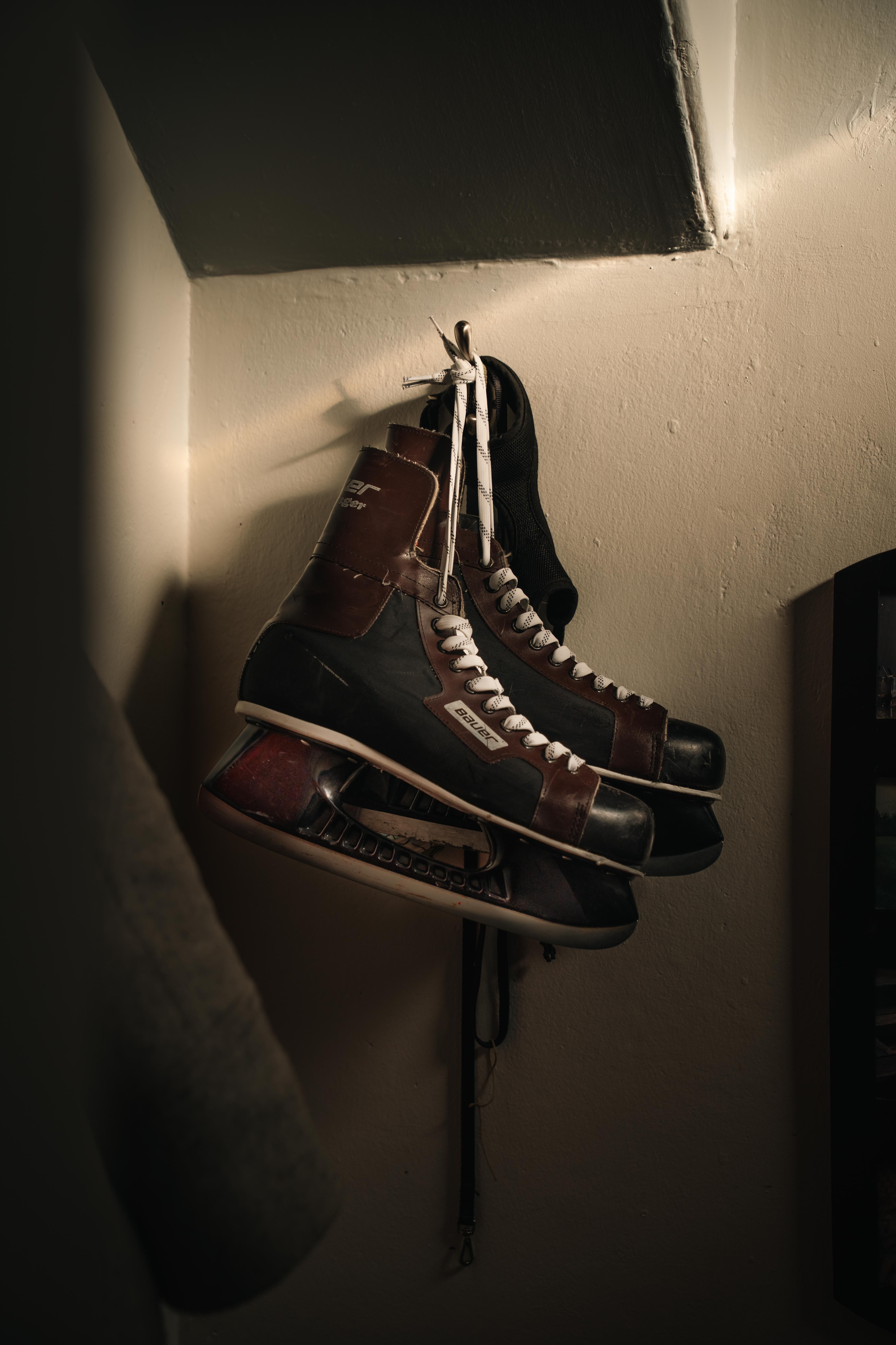 Classic Ice Hockey Skates Hanging Indoors · Free Stock Photo