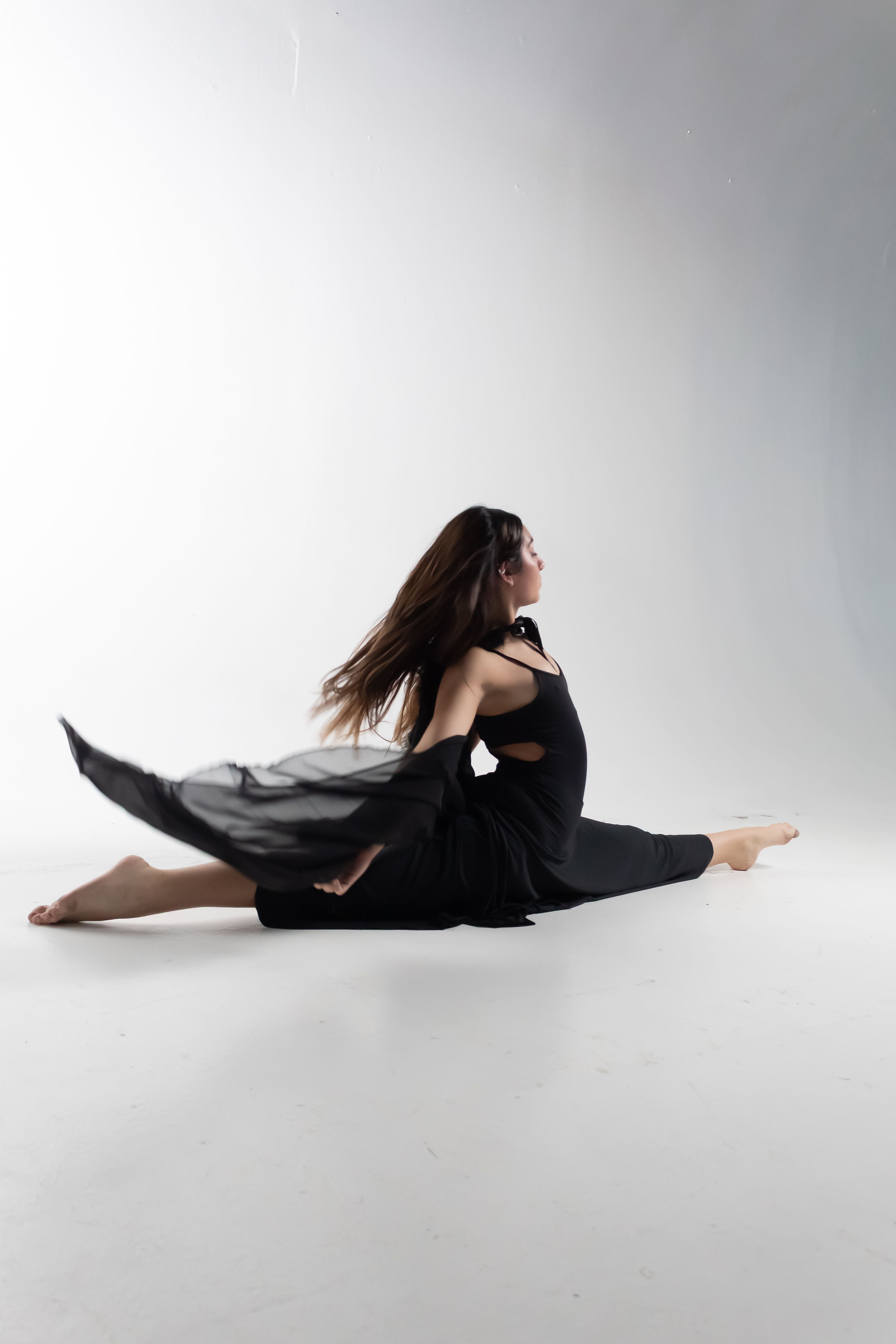 Graceful Dance Pose in Studio Setting · Free Stock Photo