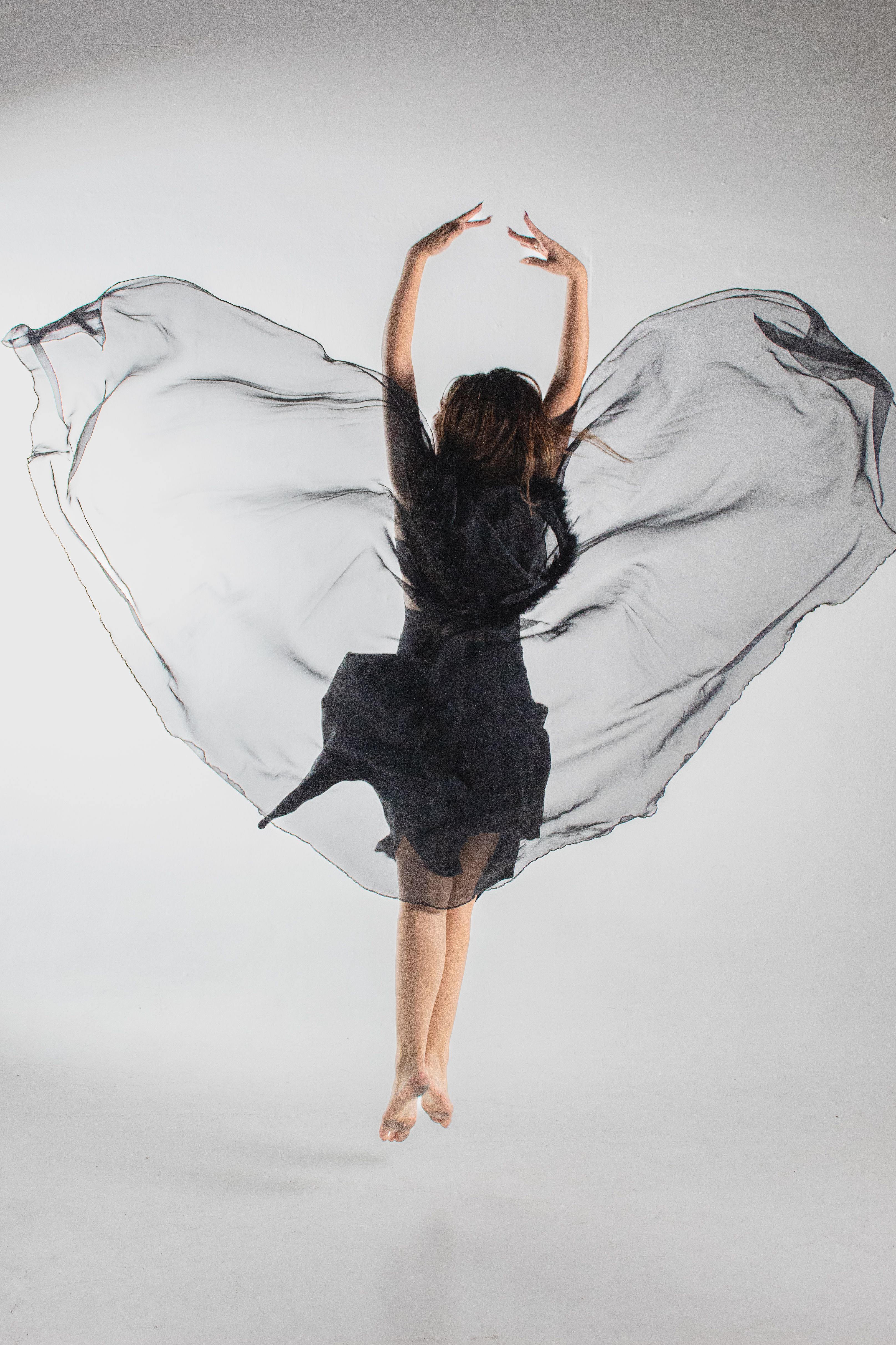 Elegant Ballet Dancer in Motion with Black Fabric · Free Stock Photo