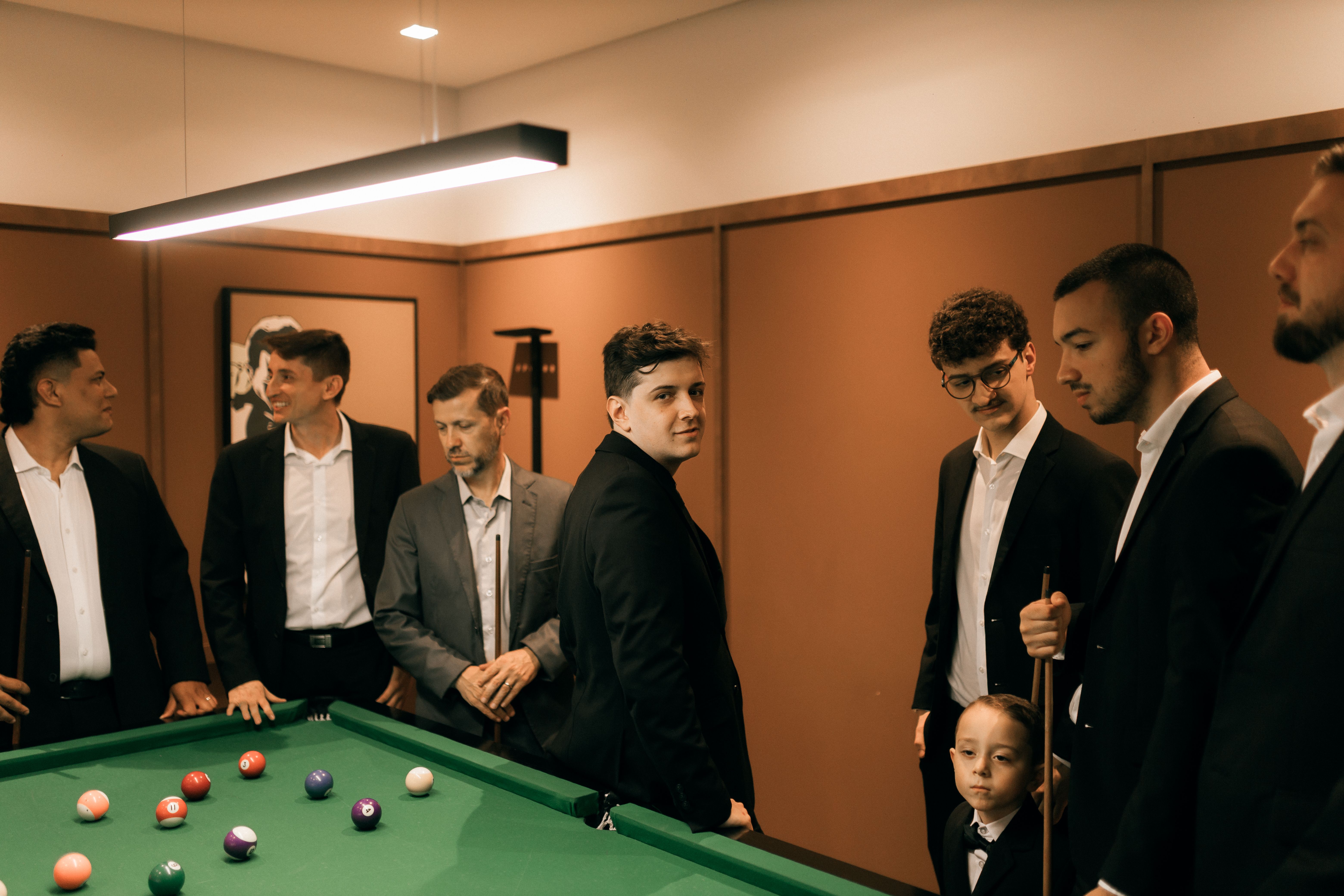 Group of Men in Suits Playing Pool in Room · Free Stock Photo