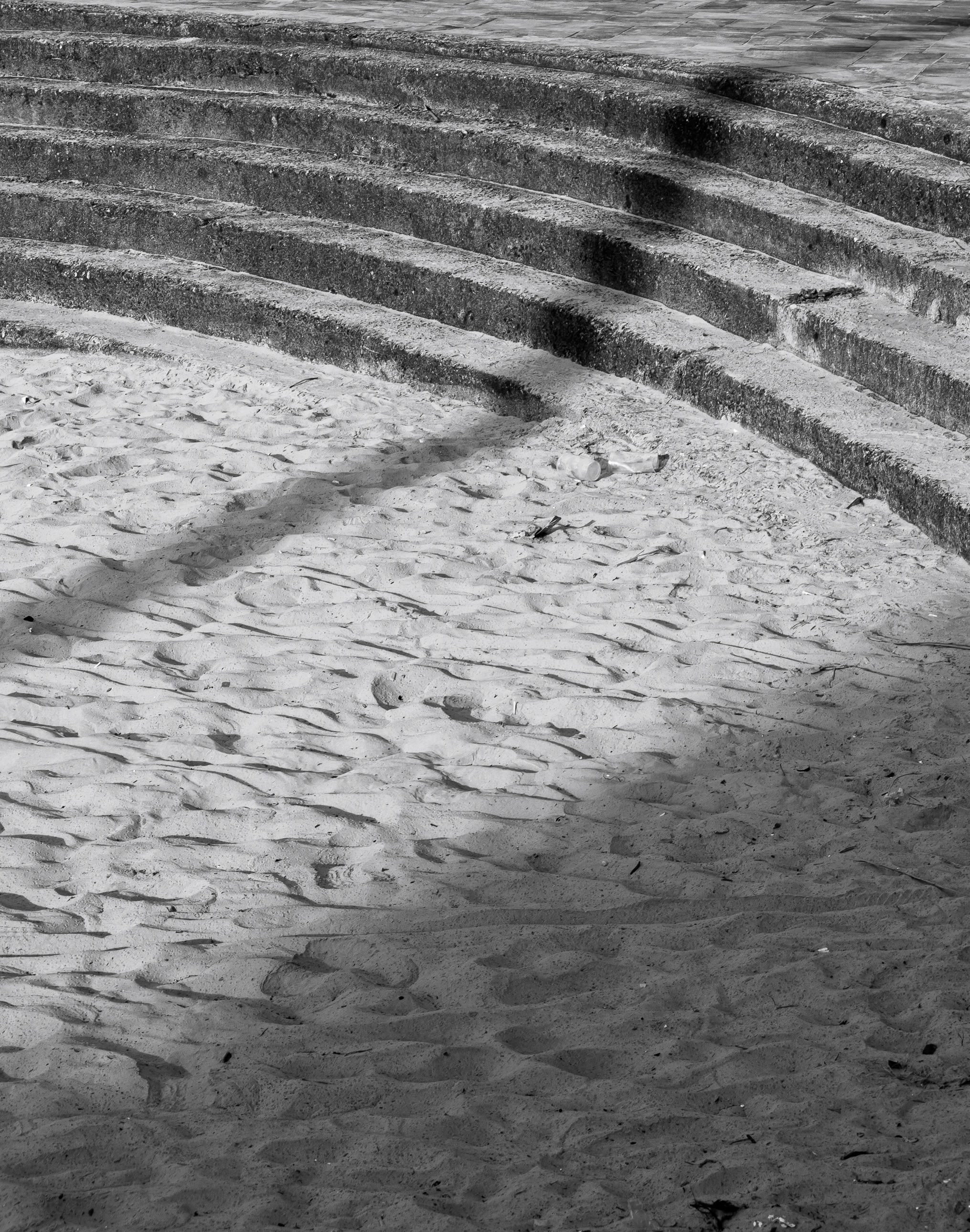Curved Concrete Steps Overlooking Empty Sand · Free Stock Photo