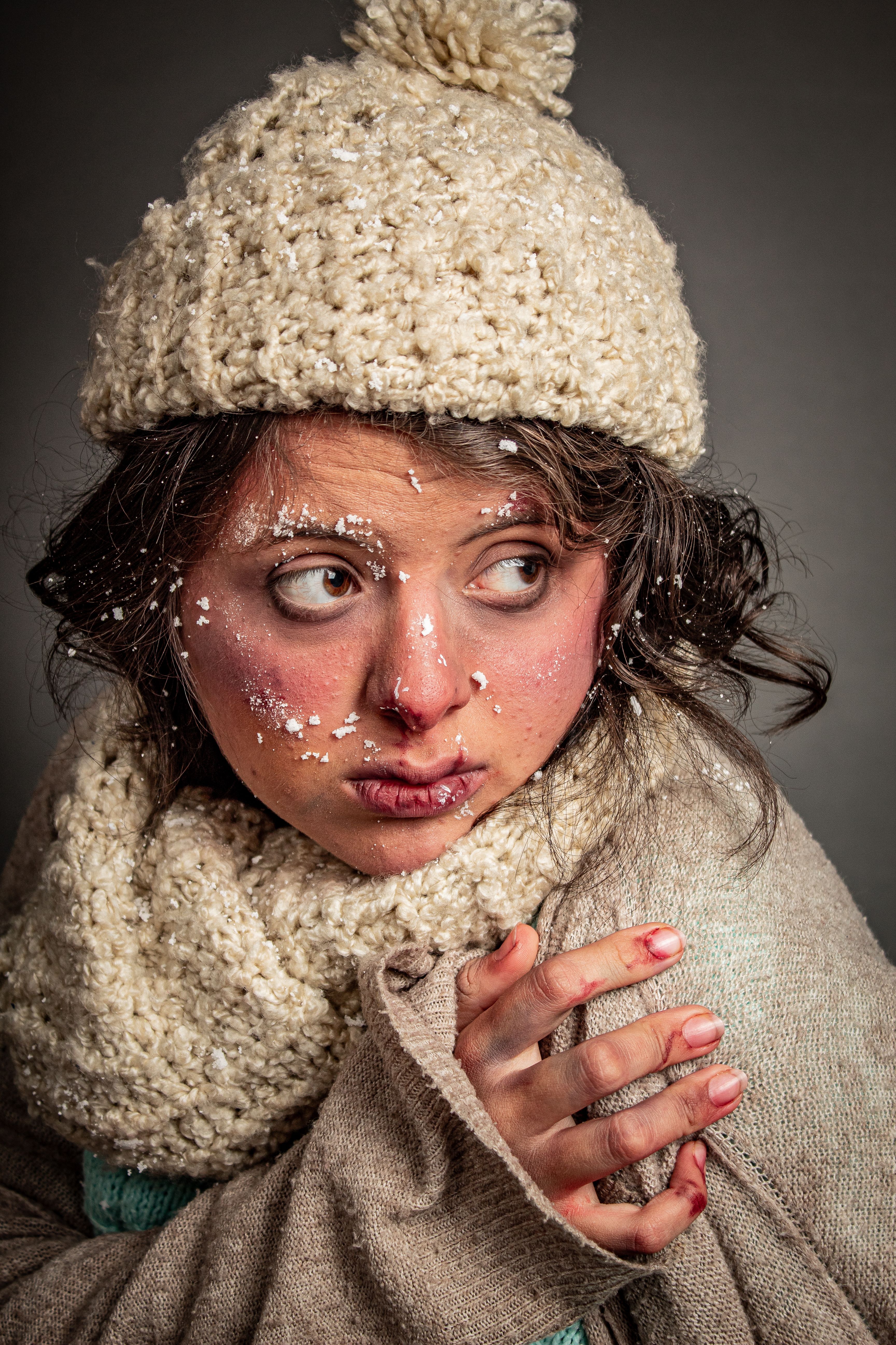 Winter Struggle: Woman Braving the Cold · Free Stock Photo