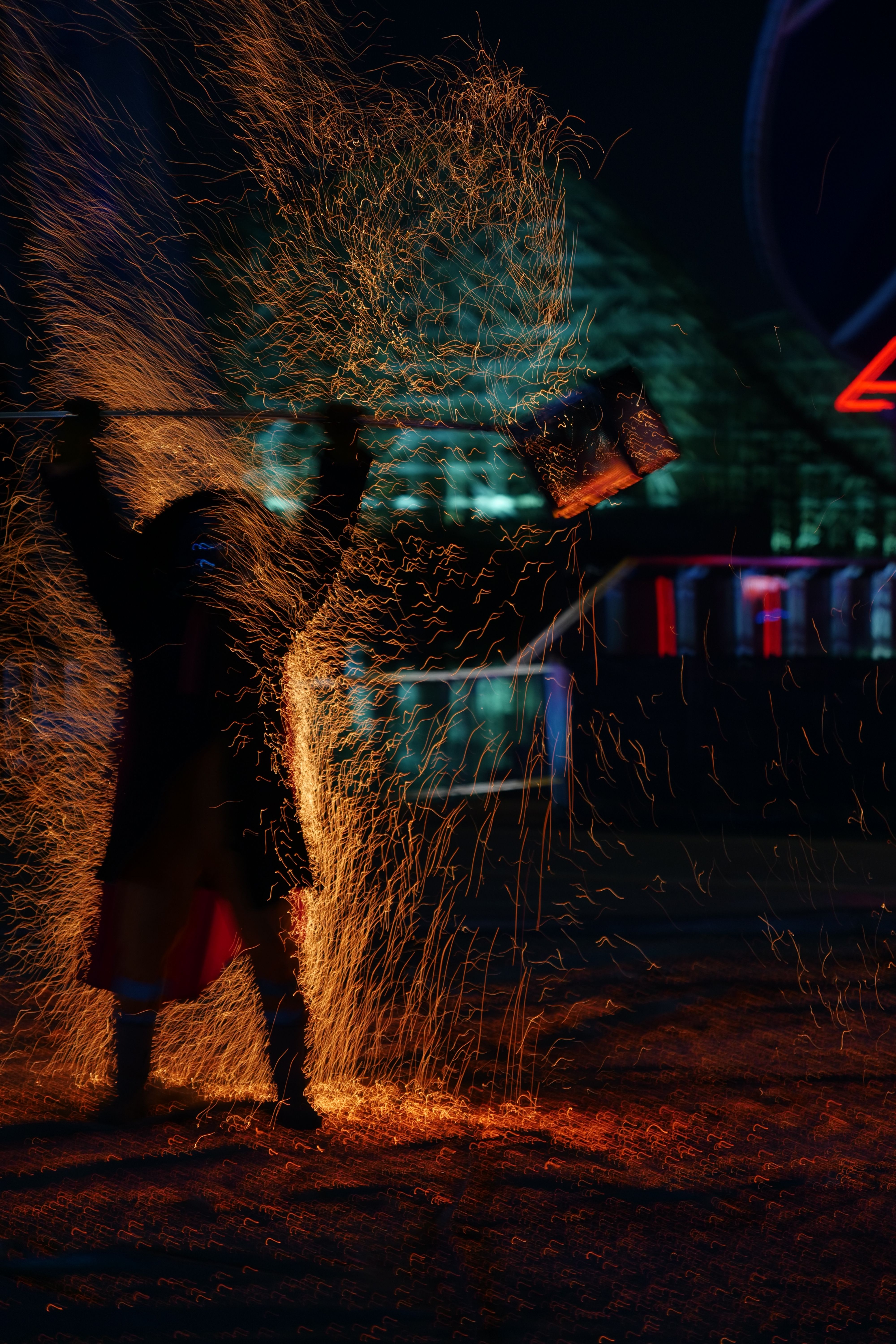 Spectacular Nighttime Fire Sparks Performance · Free Stock Photo