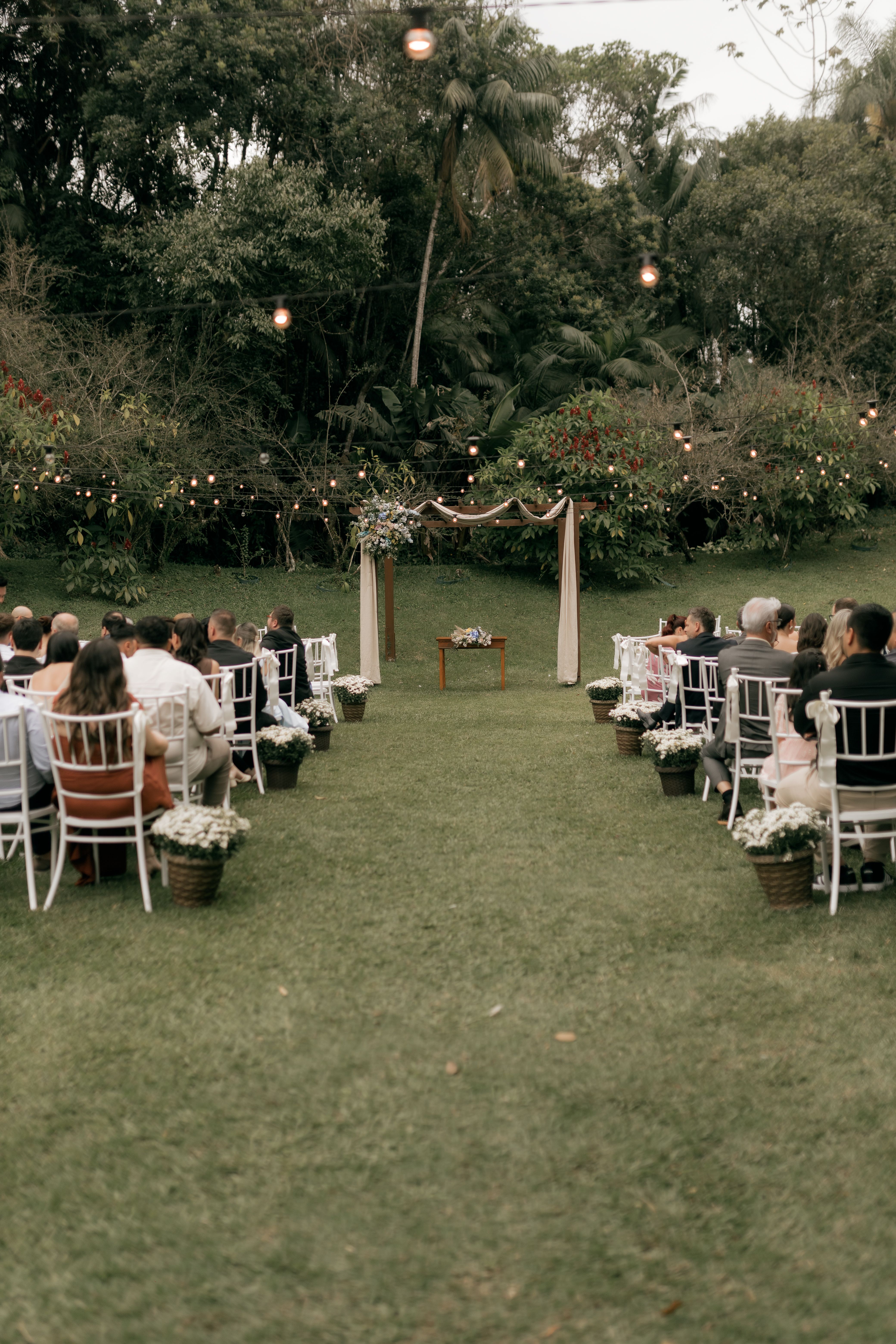 Outdoor Garden Wedding Ceremony Setup with Guests · Free Stock Photo