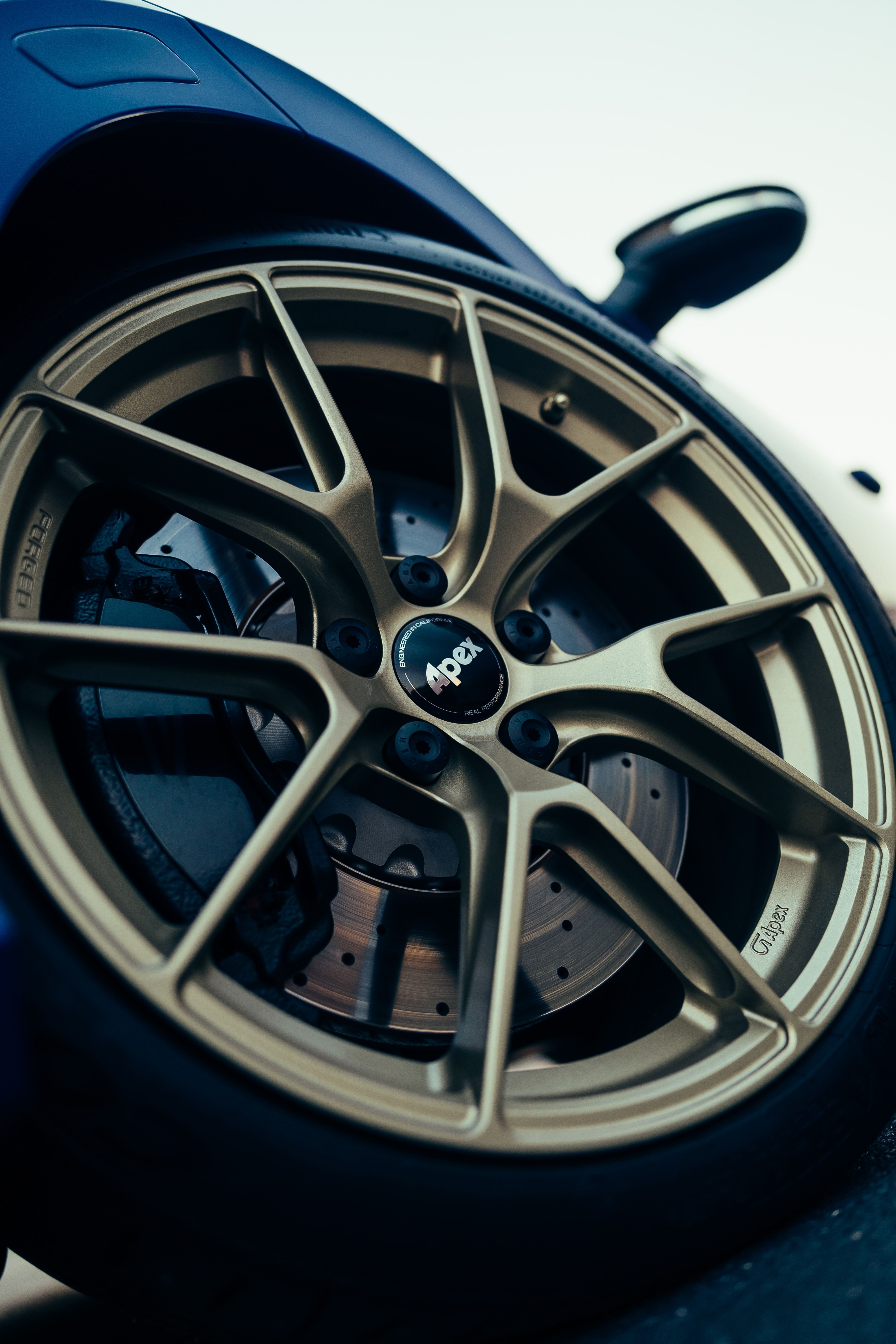 Close-Up View of Stylish Car Wheel Rim · Free Stock Photo