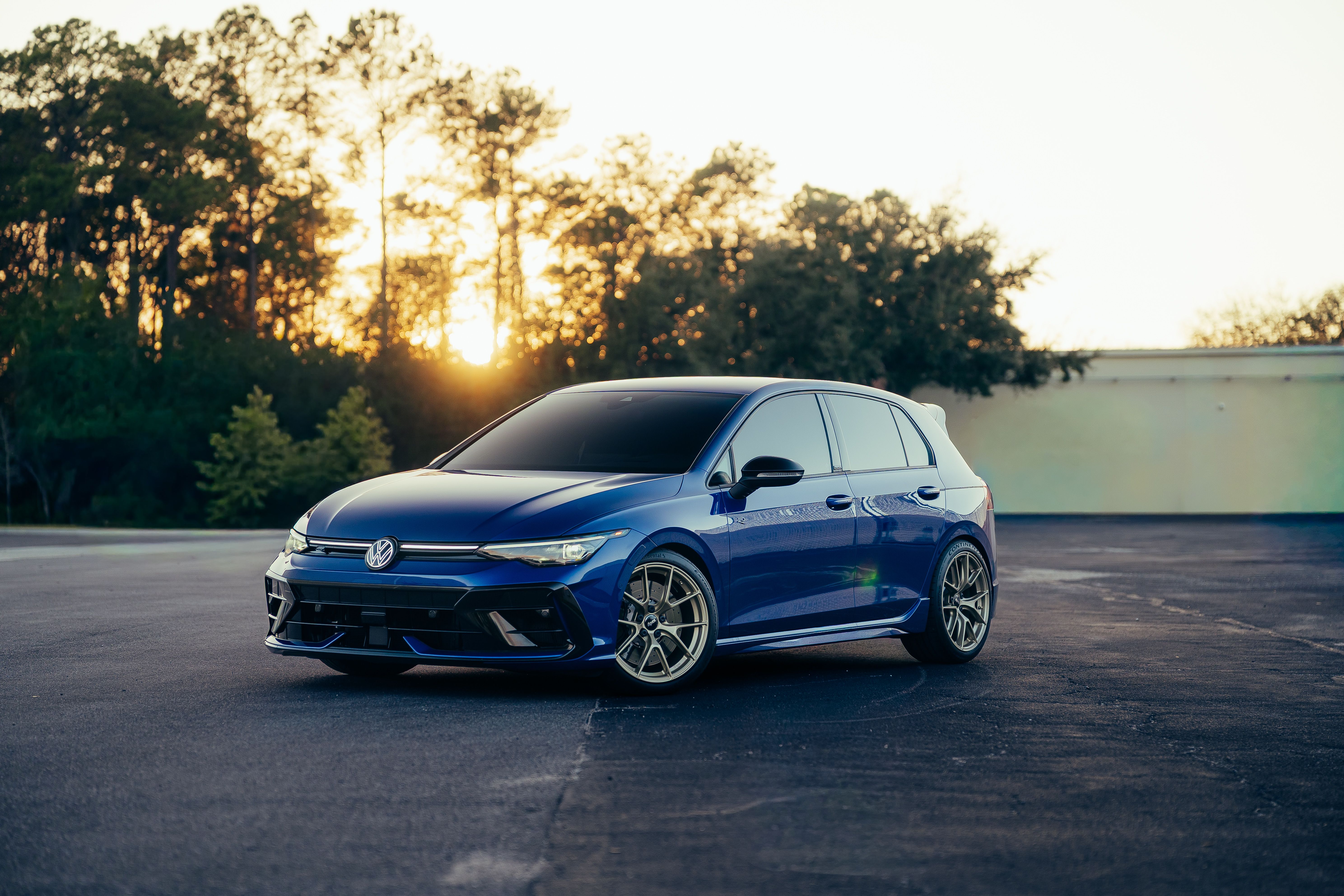 Blue Volkswagen Hatchback at Sunset Outdoors · Free Stock Photo