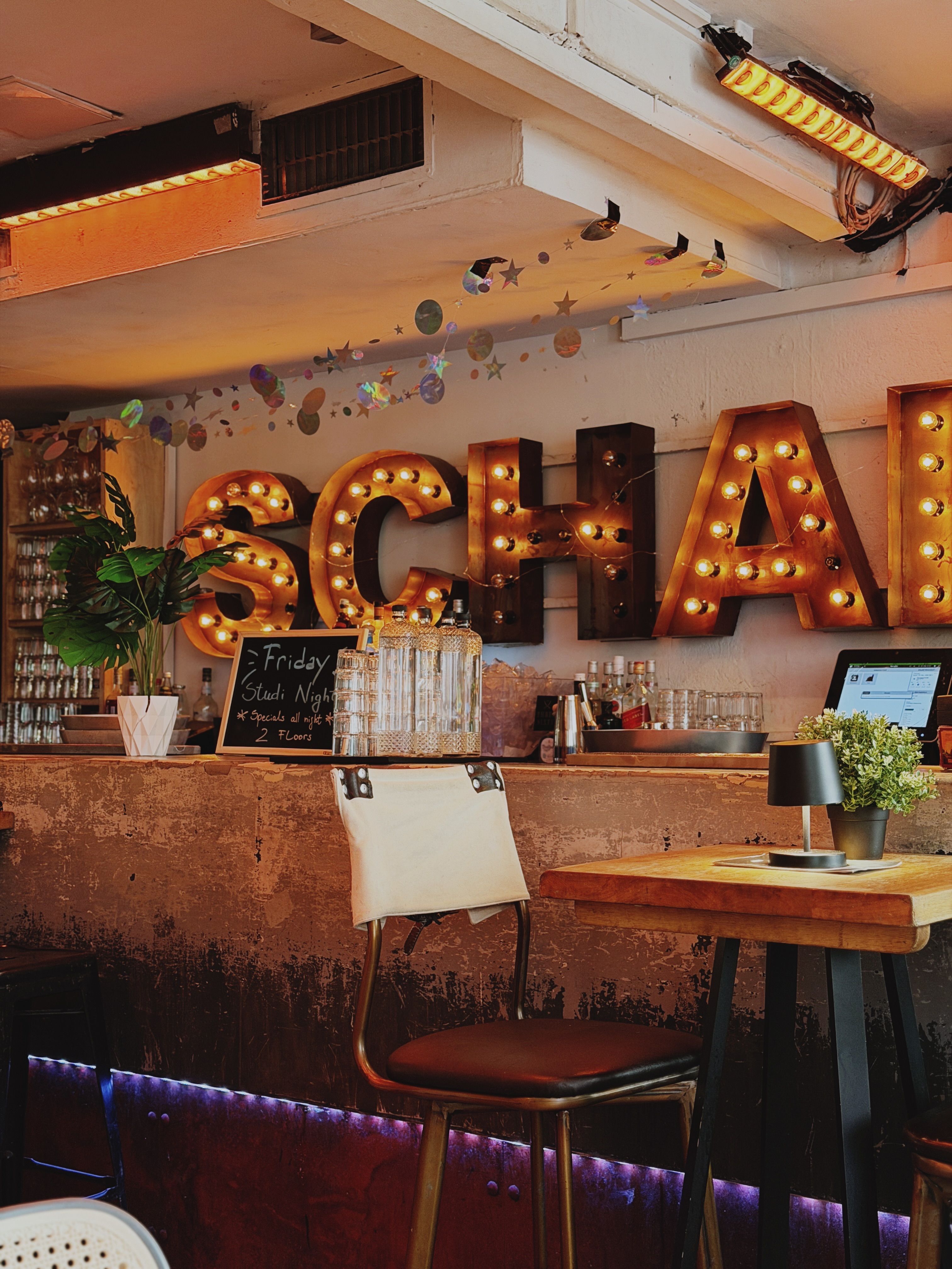 Cozy Bar Interior with Vintage Lighting Decor · Free Stock Photo