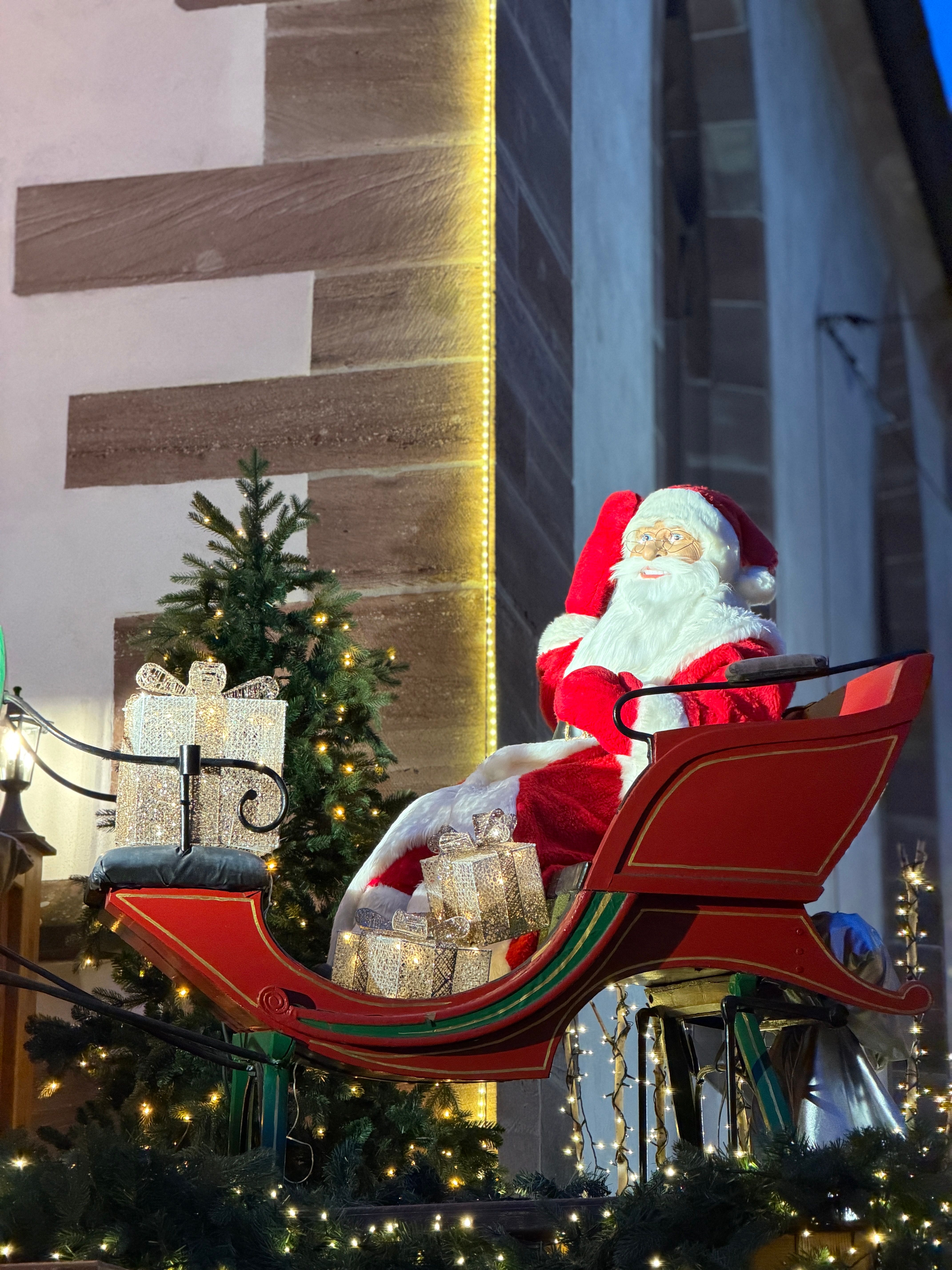 Festive Santa Claus Display with Sleigh · Free Stock Photo