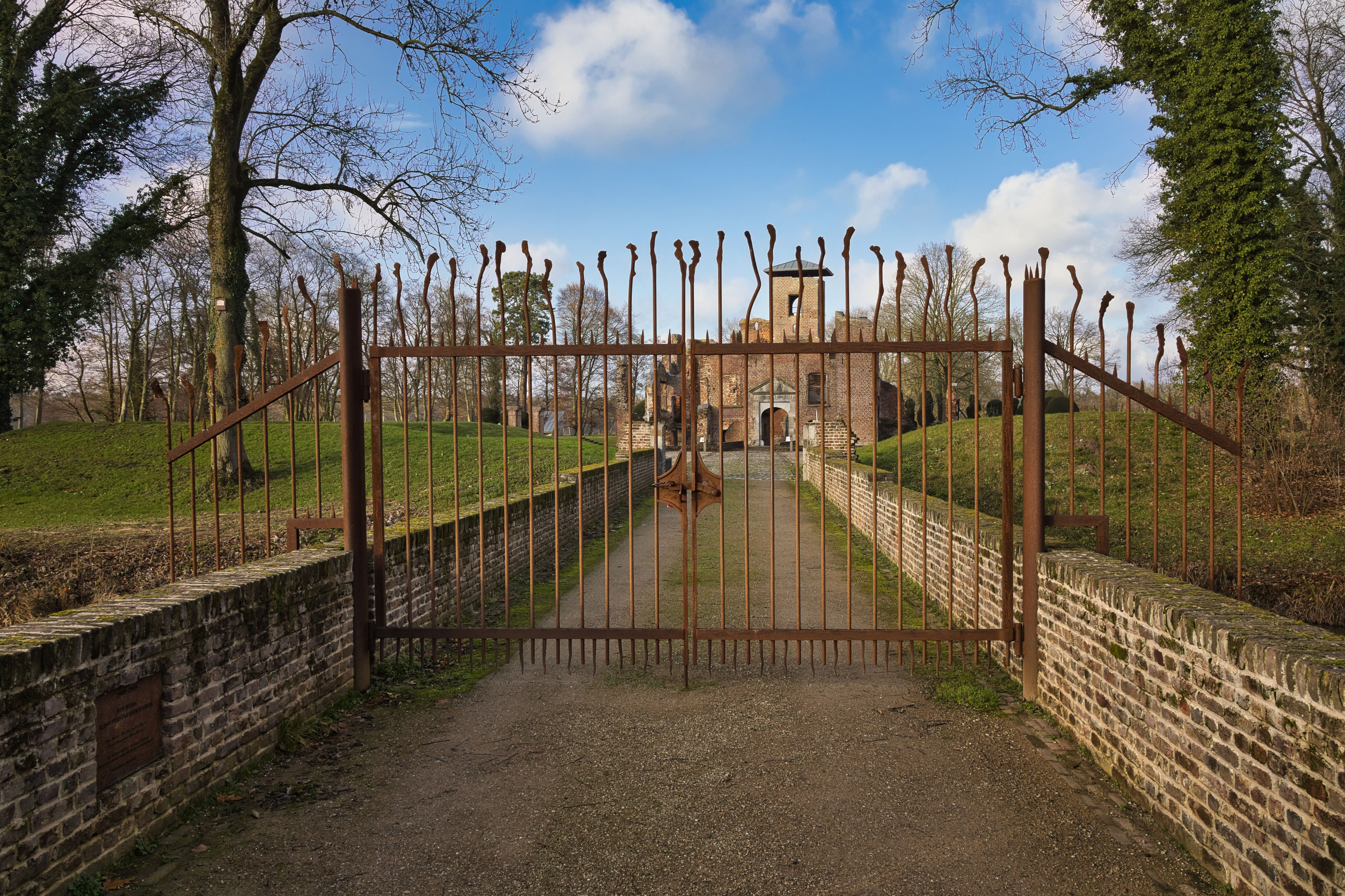 Historic Castle with Rustic Iron Gate · Free Stock Photo
