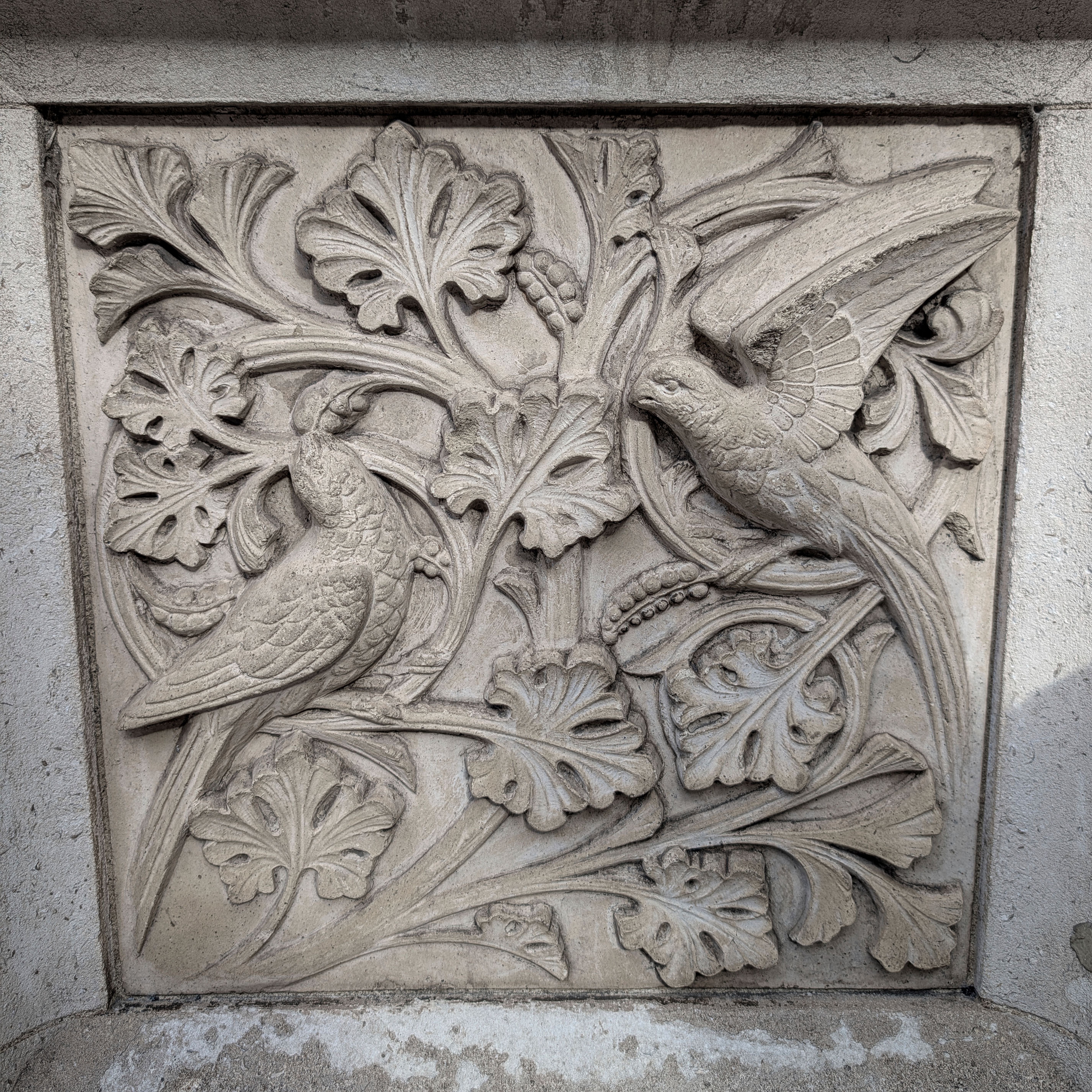 Intricate Stone Carving of Birds and Foliage · Free Stock Photo