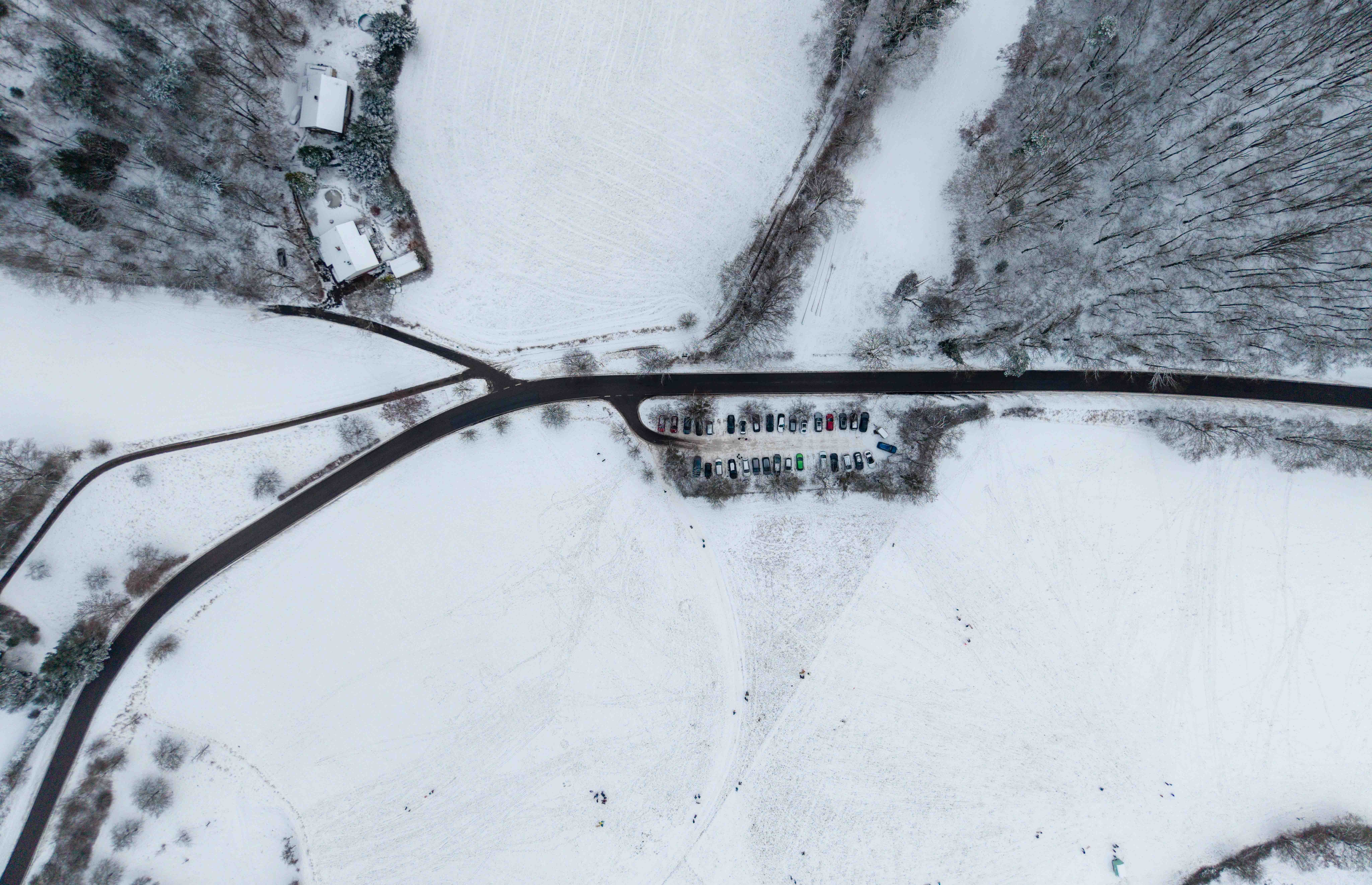 Aerial View of Snowy Landscape with Road and Cars · Free Stock Photo