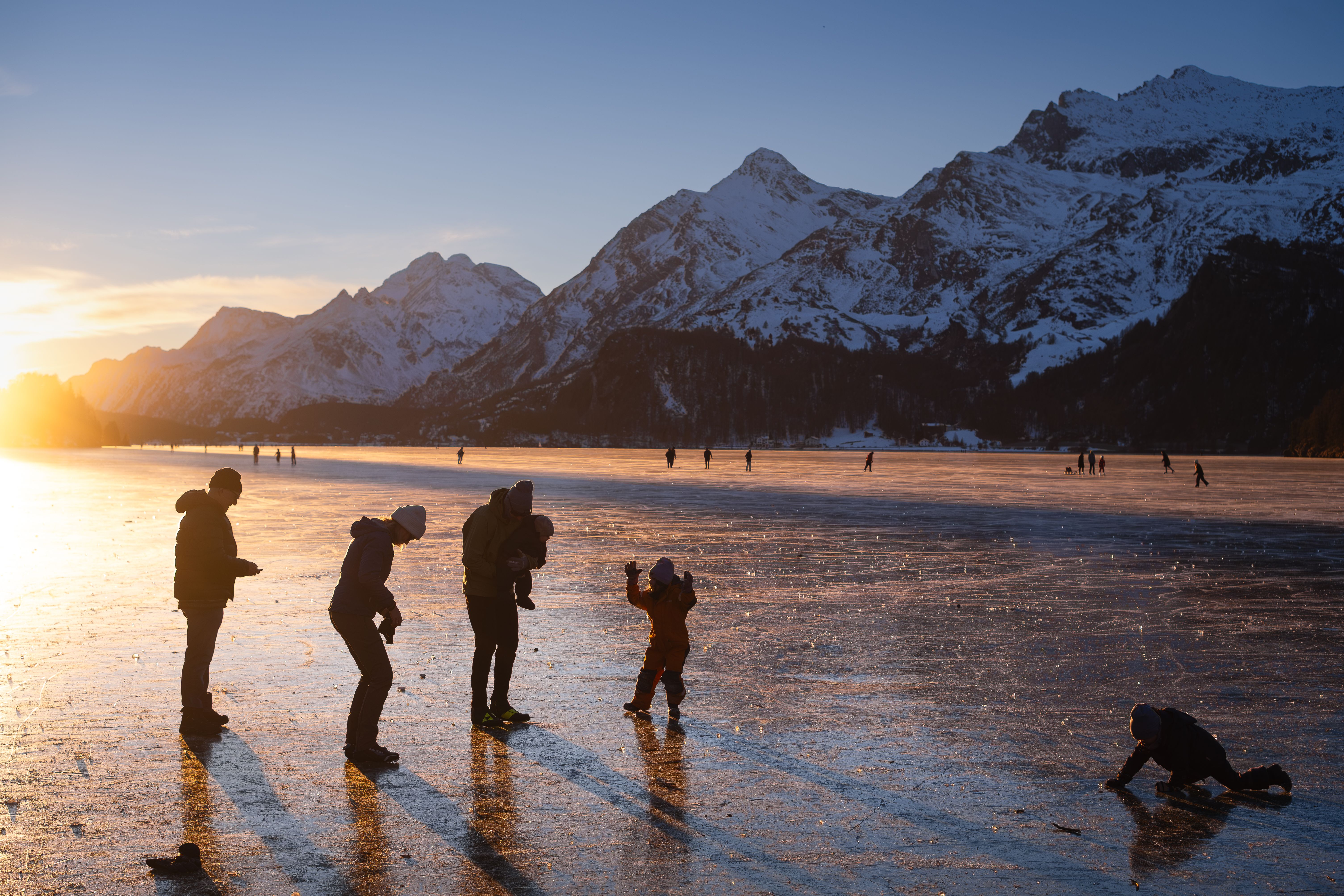 Silhouette Family Ice Skating at Sunset · Free Stock Photo