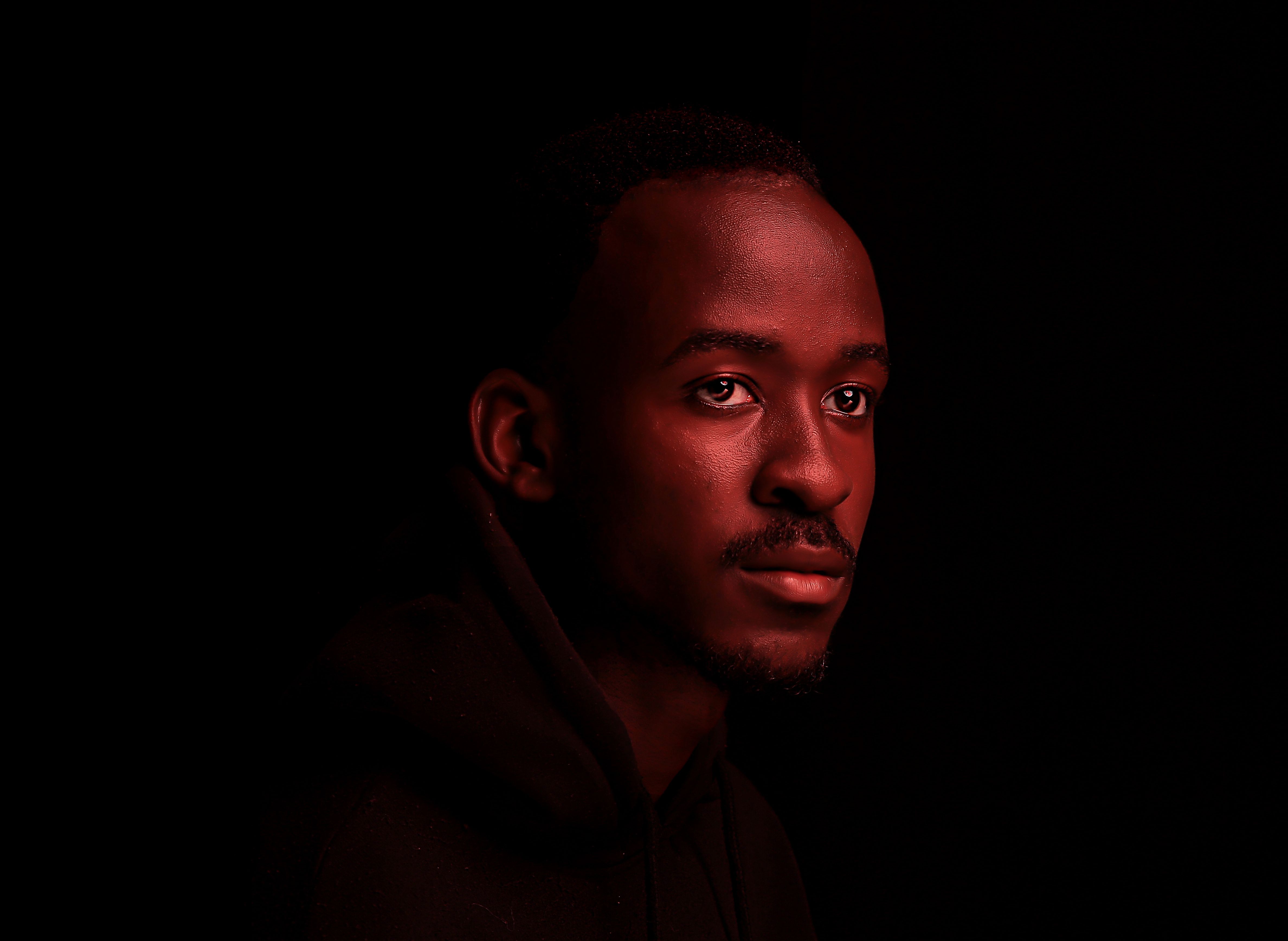 Dramatic Portrait of a Man in Red Light · Free Stock Photo