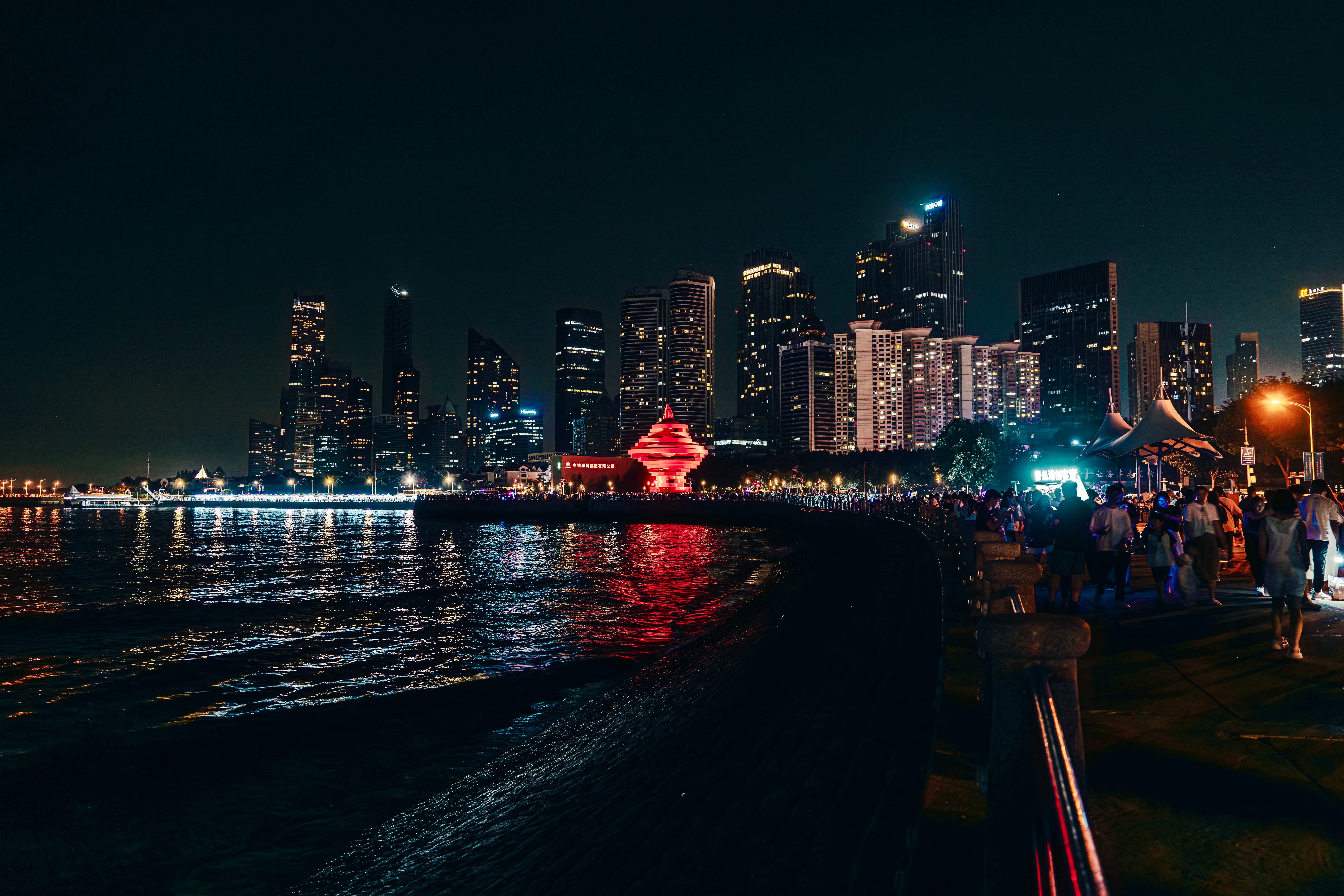 Vibrant Night Skyline of Qingdao with Illuminated Sculpture · Free ...