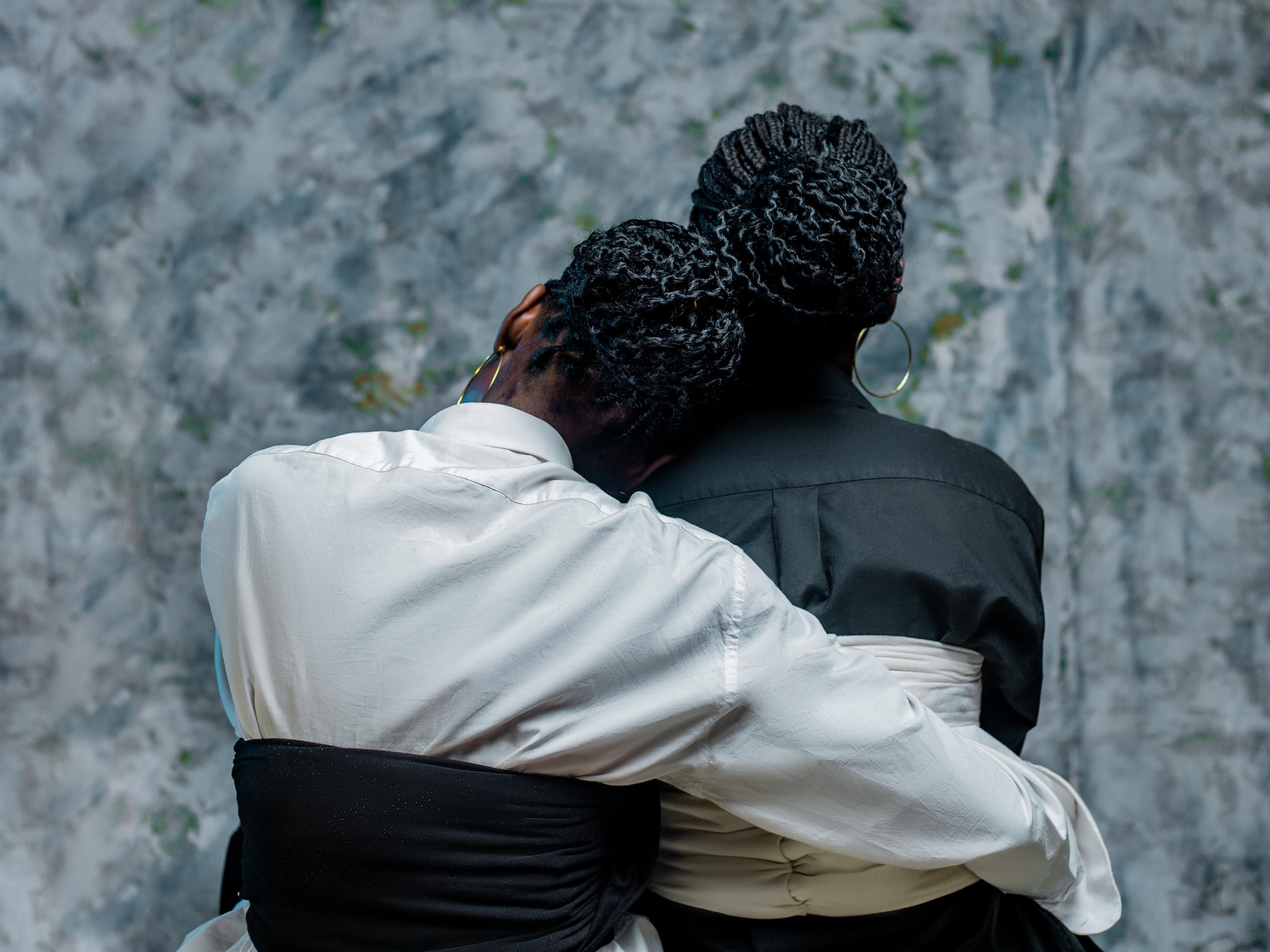 Embrace of Two People in Artistic Pose · Free Stock Photo