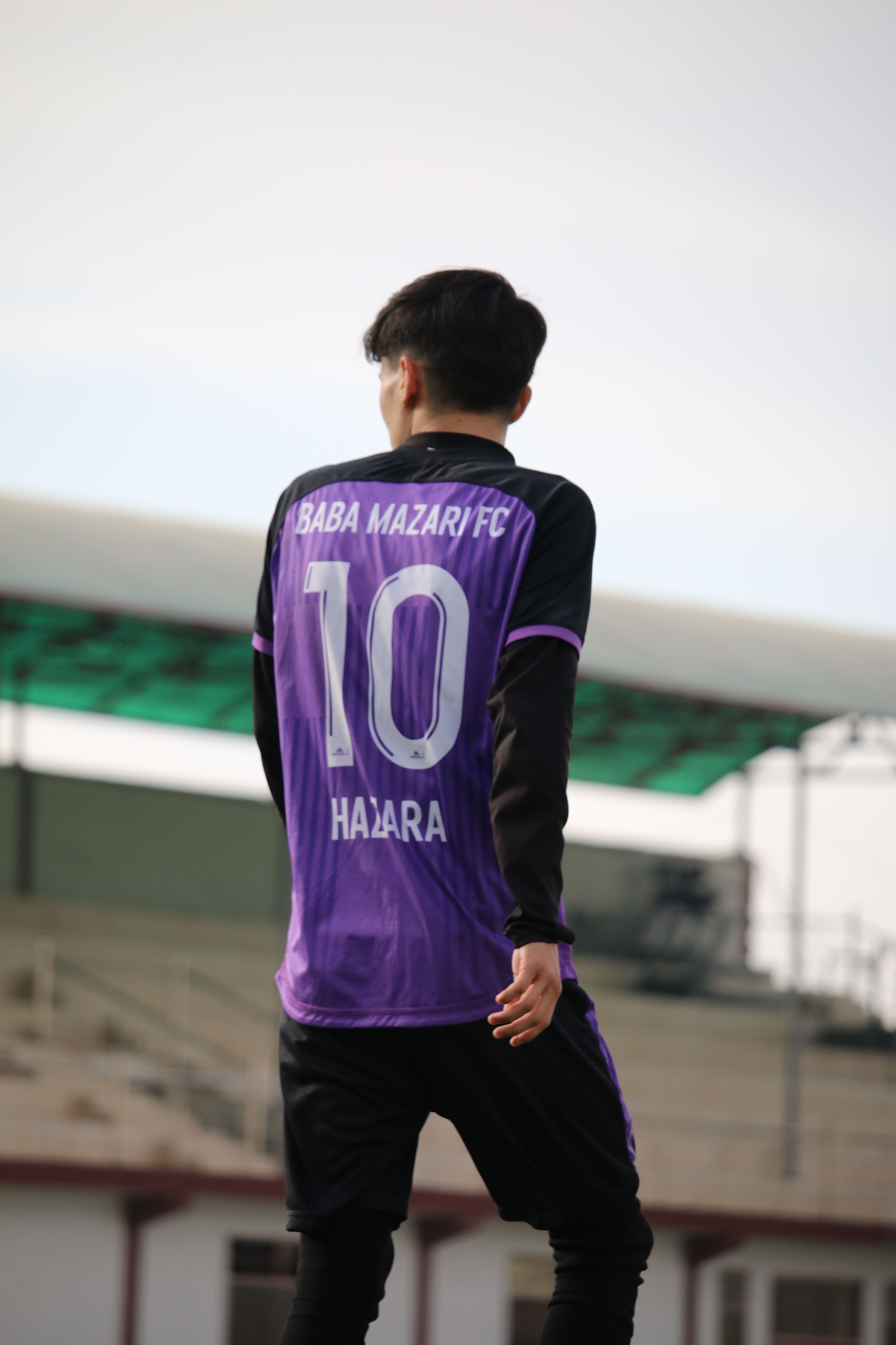 Soccer Player in Purple Jersey on Field · Free Stock Photo
