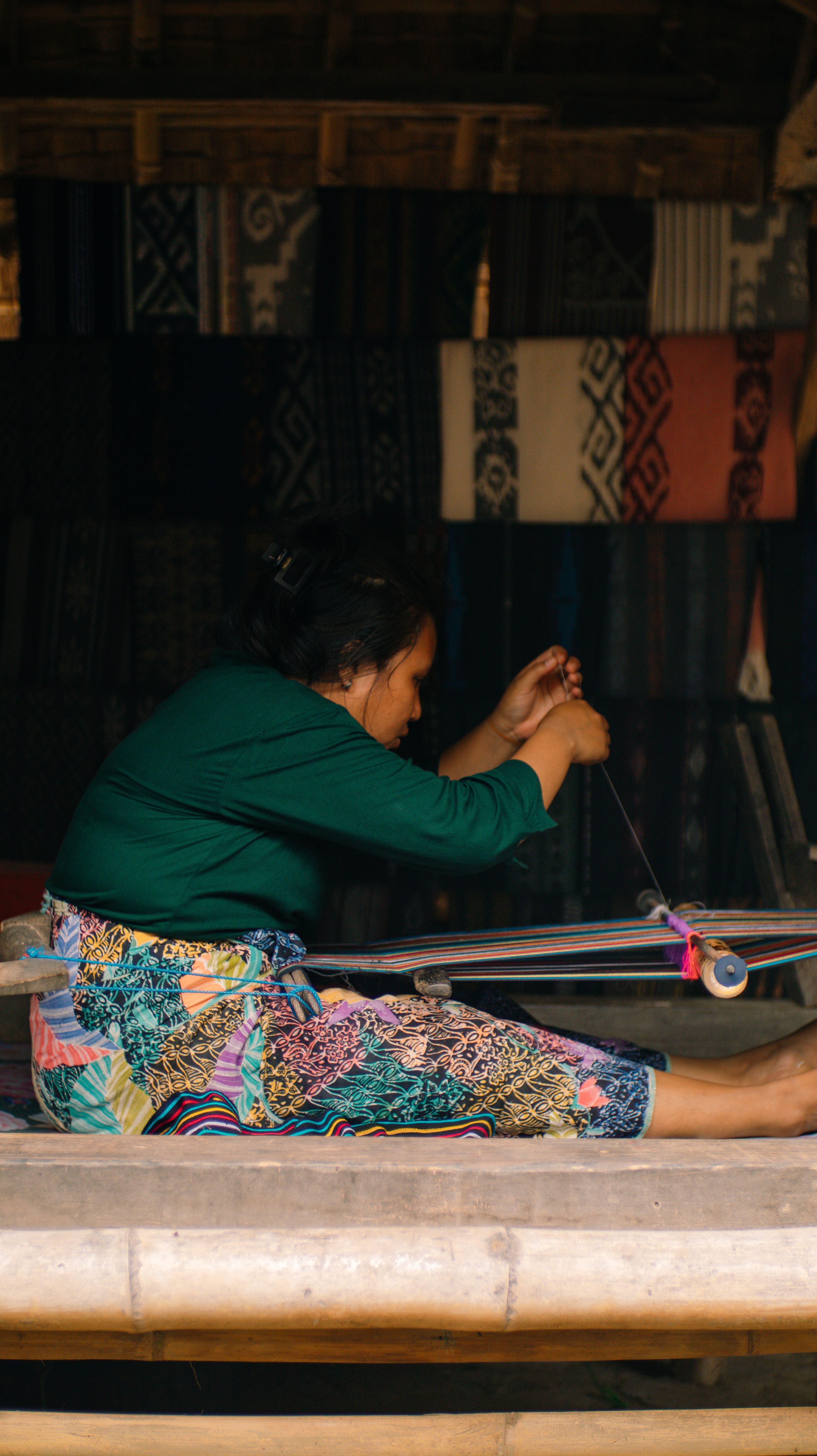 Traditional Weaver Creating Colorful Textiles Indoors · Free Stock Photo