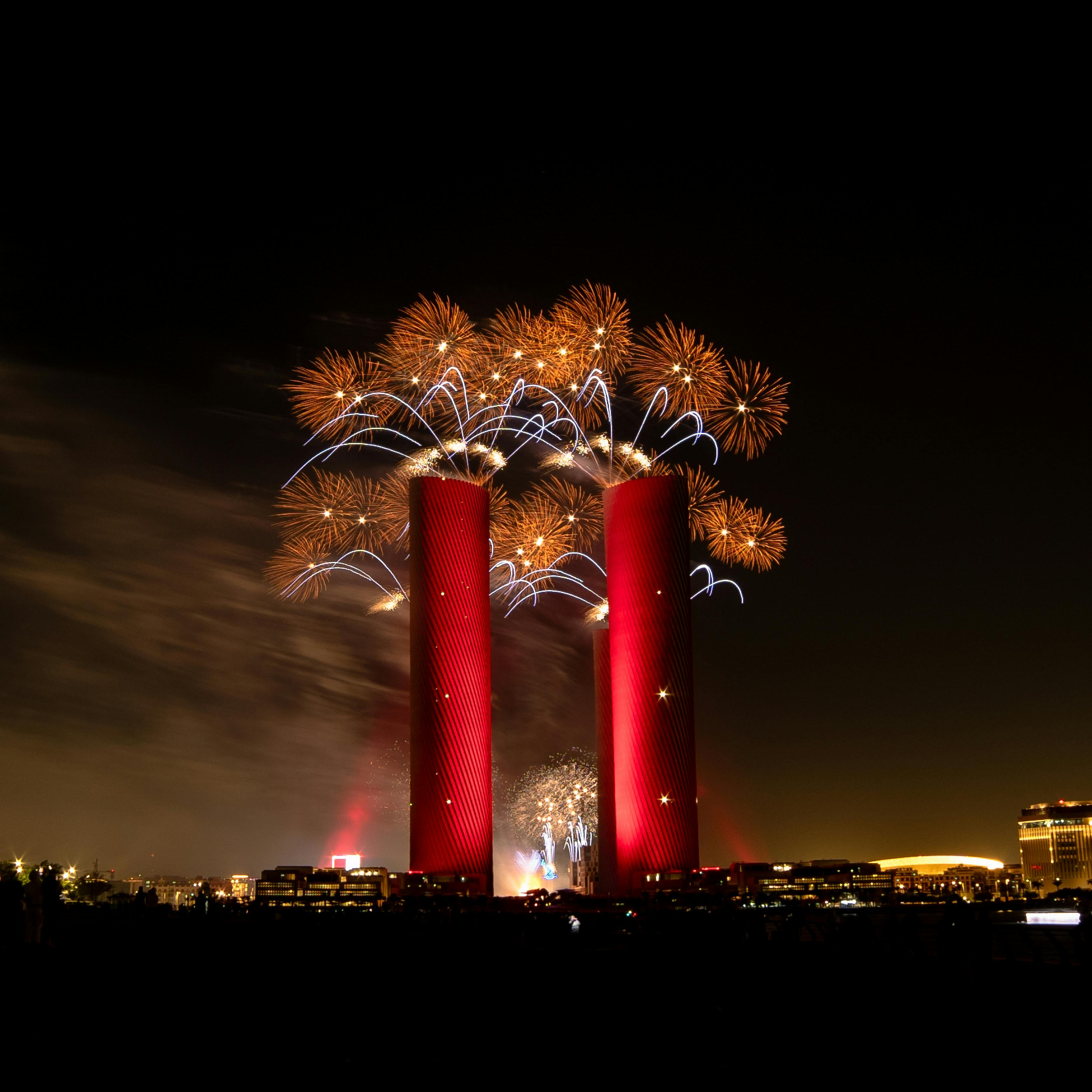 Colorful Fireworks Over Lusail Towers at Night · Free Stock Photo