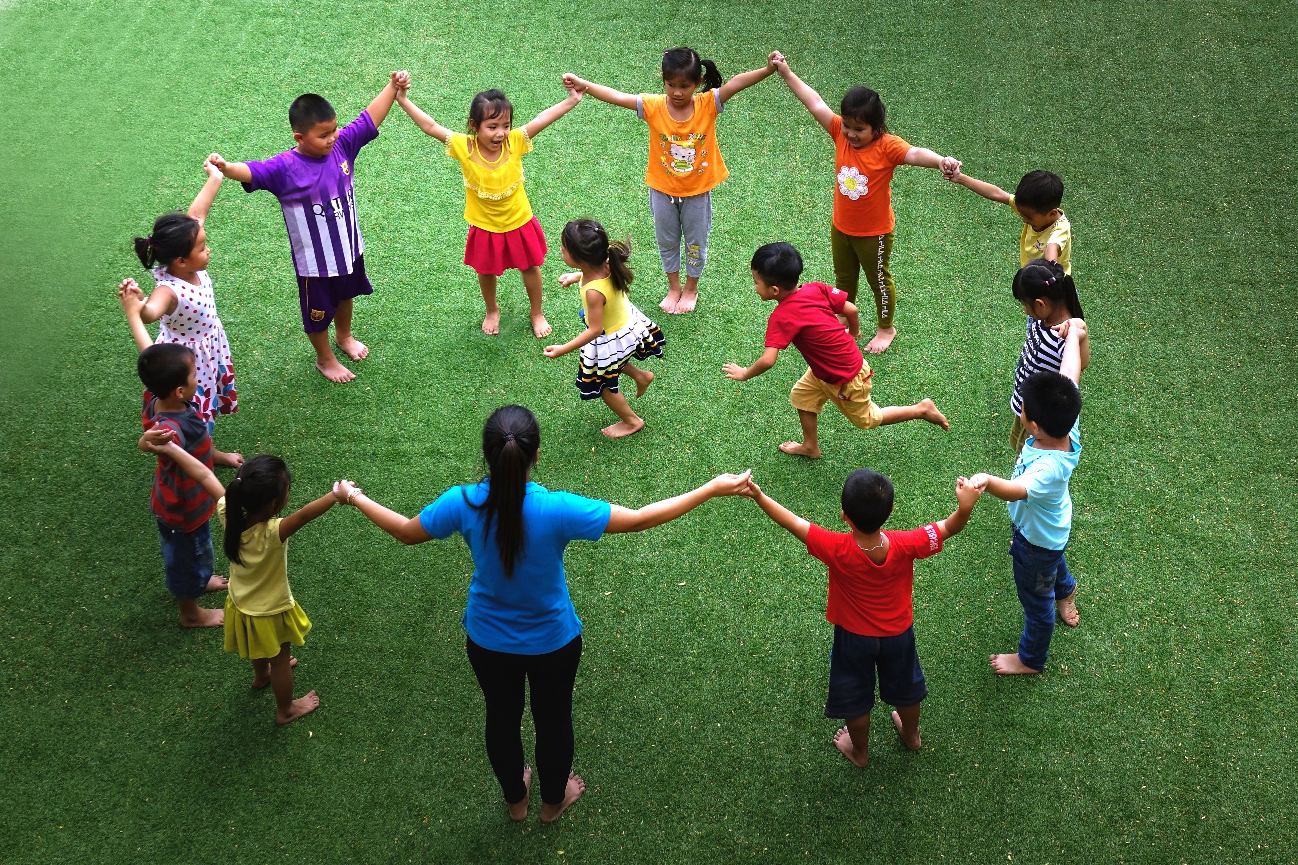 Children Playing Circle Game Outdoors · Free Stock Photo