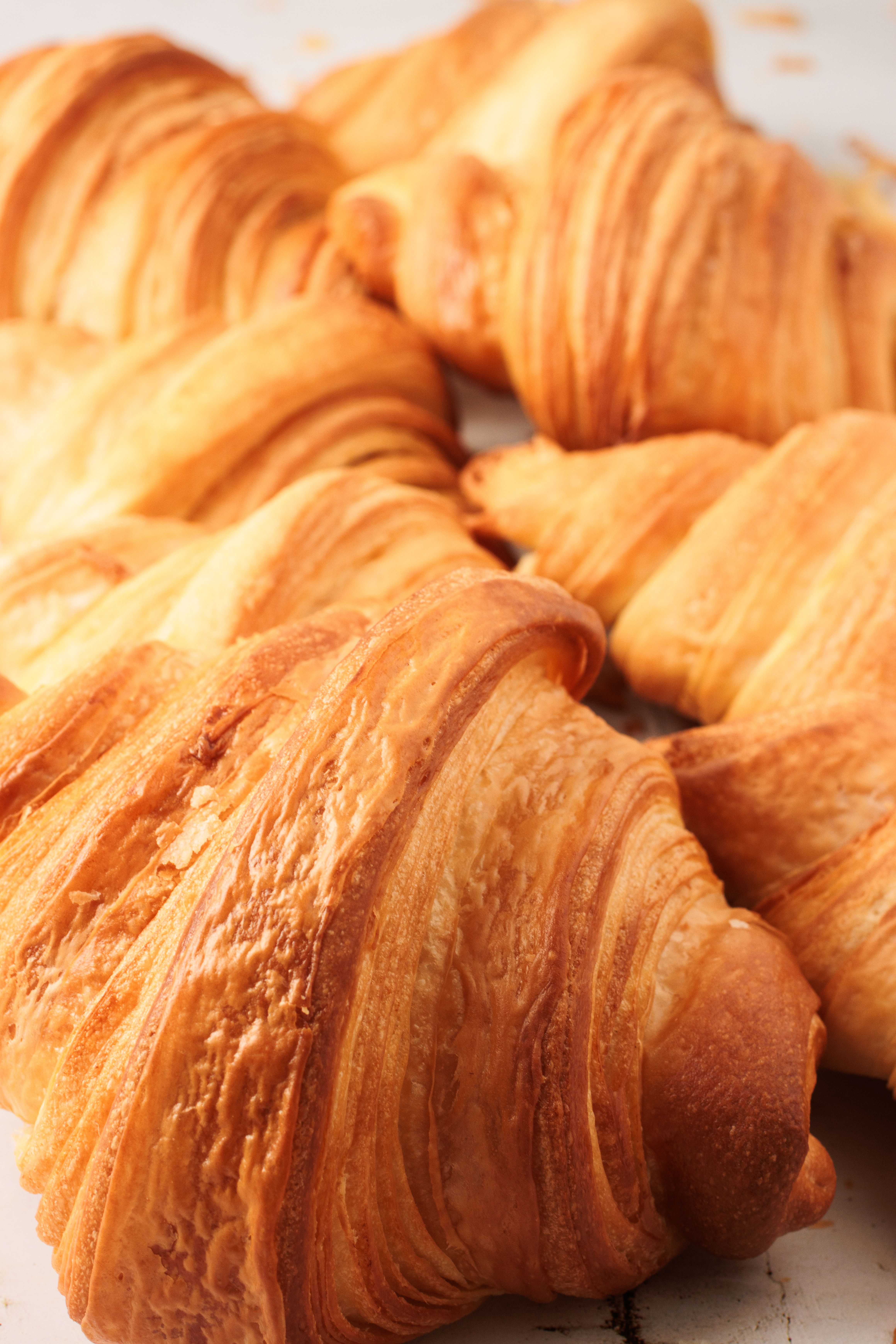 Golden Freshly Baked Croissants Close-Up View · Free Stock Photo